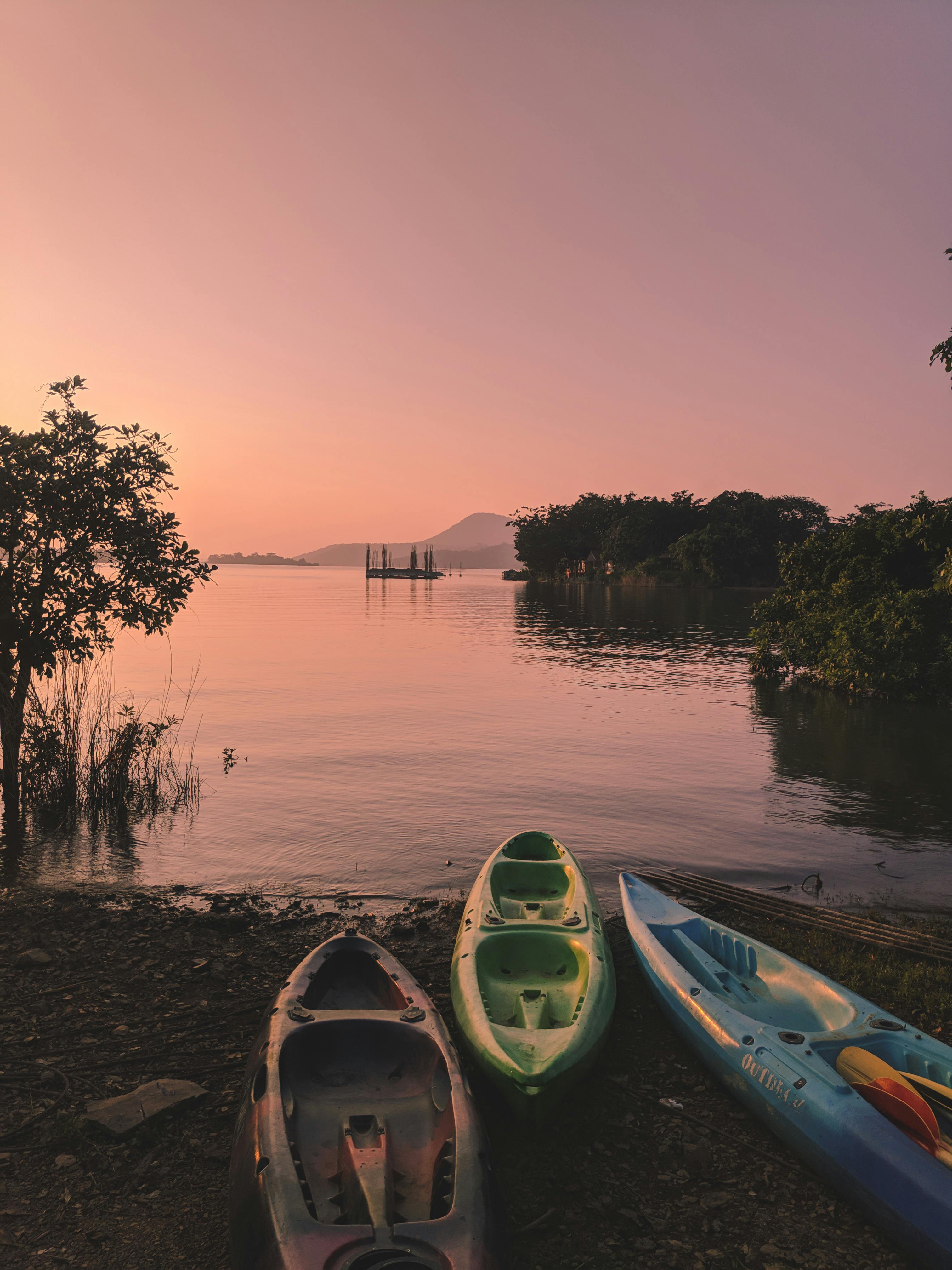 Brown Speedboat at Blue Sea Beside Brown Wooden Sea Dock during Golden ...