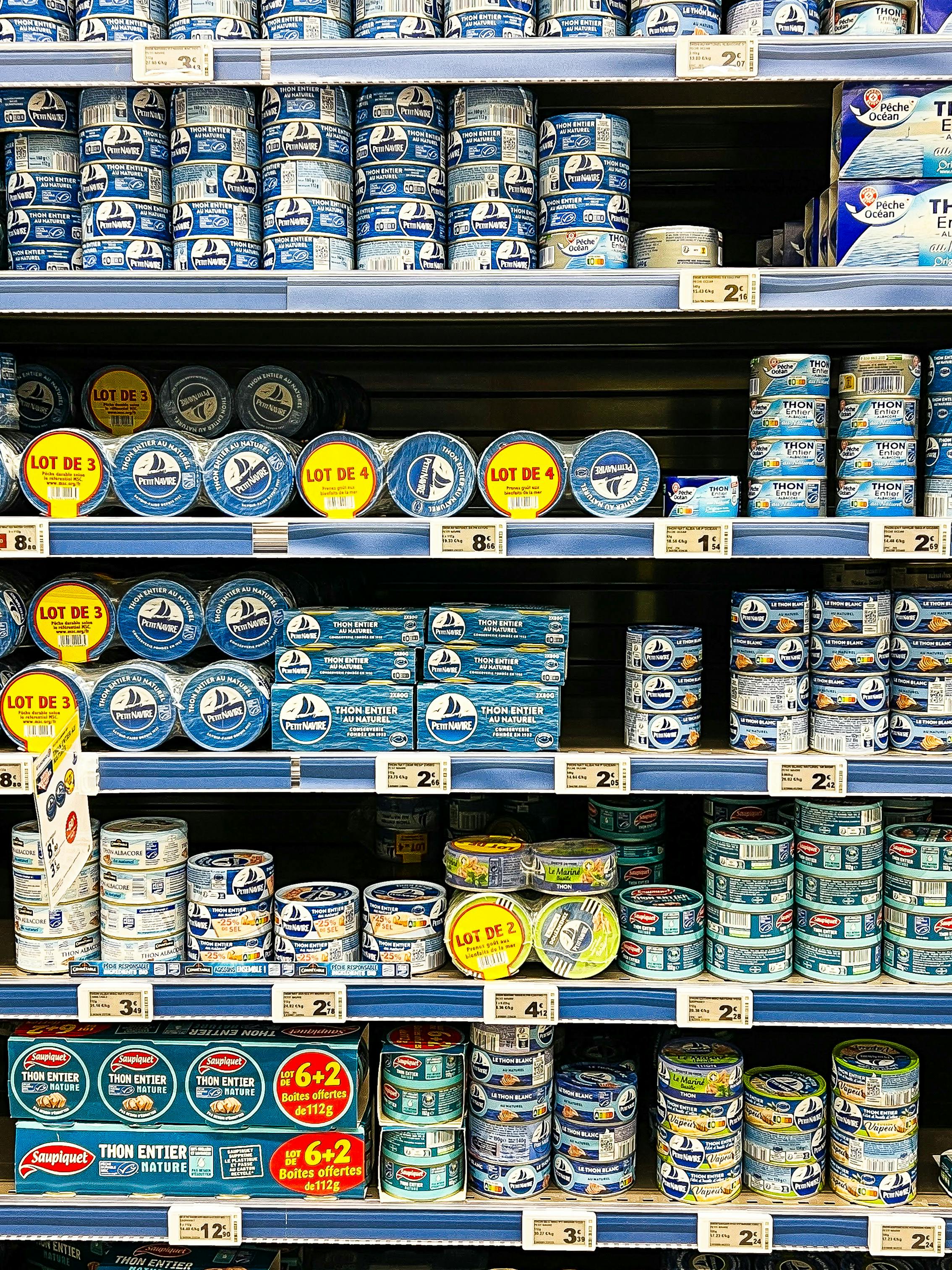 Colorful Display of Tinned Fish in French Supermarket · Free Stock Photo