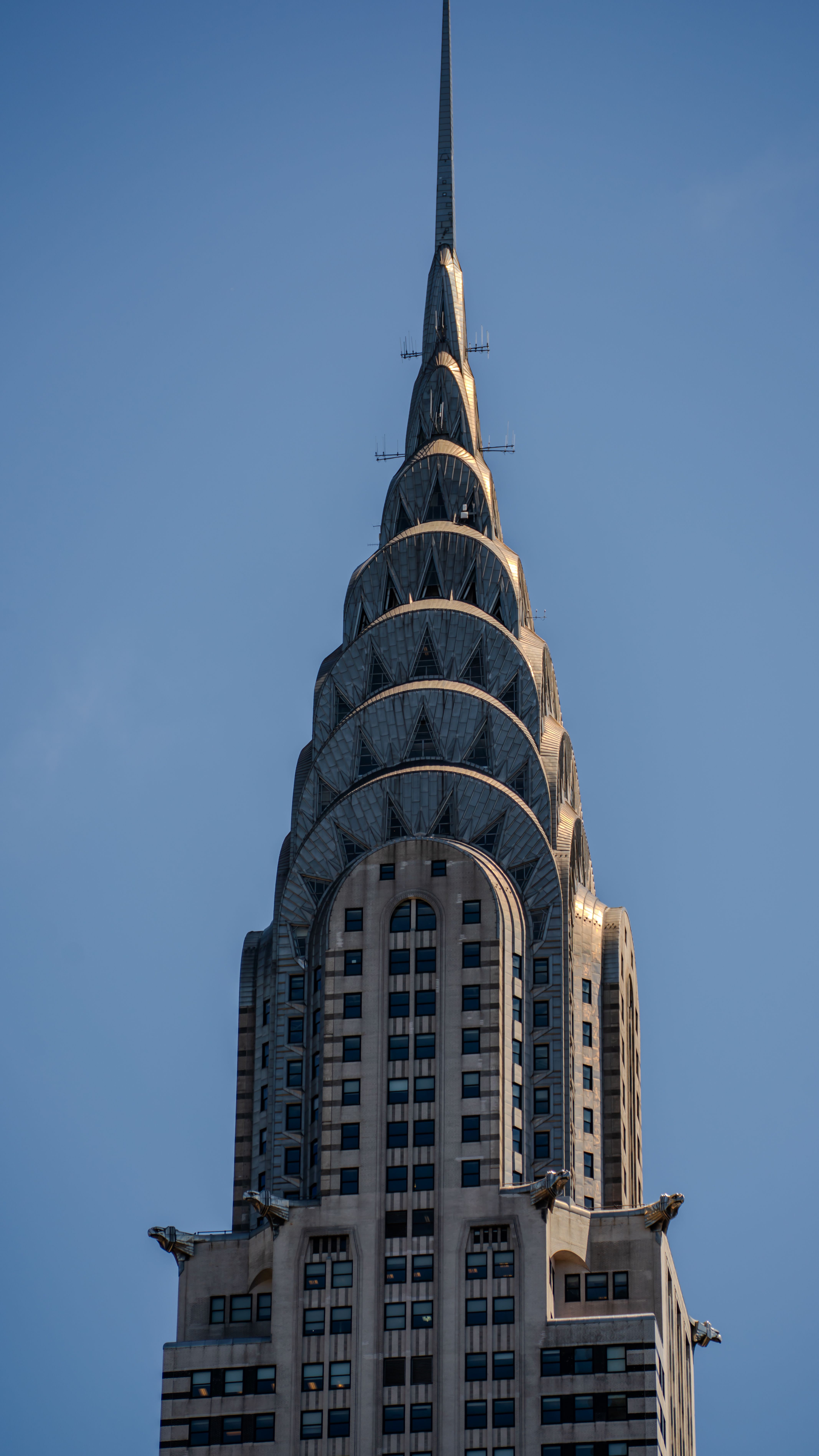 Iconic Chrysler Building Spire against Blue Sky · Free Stock Photo