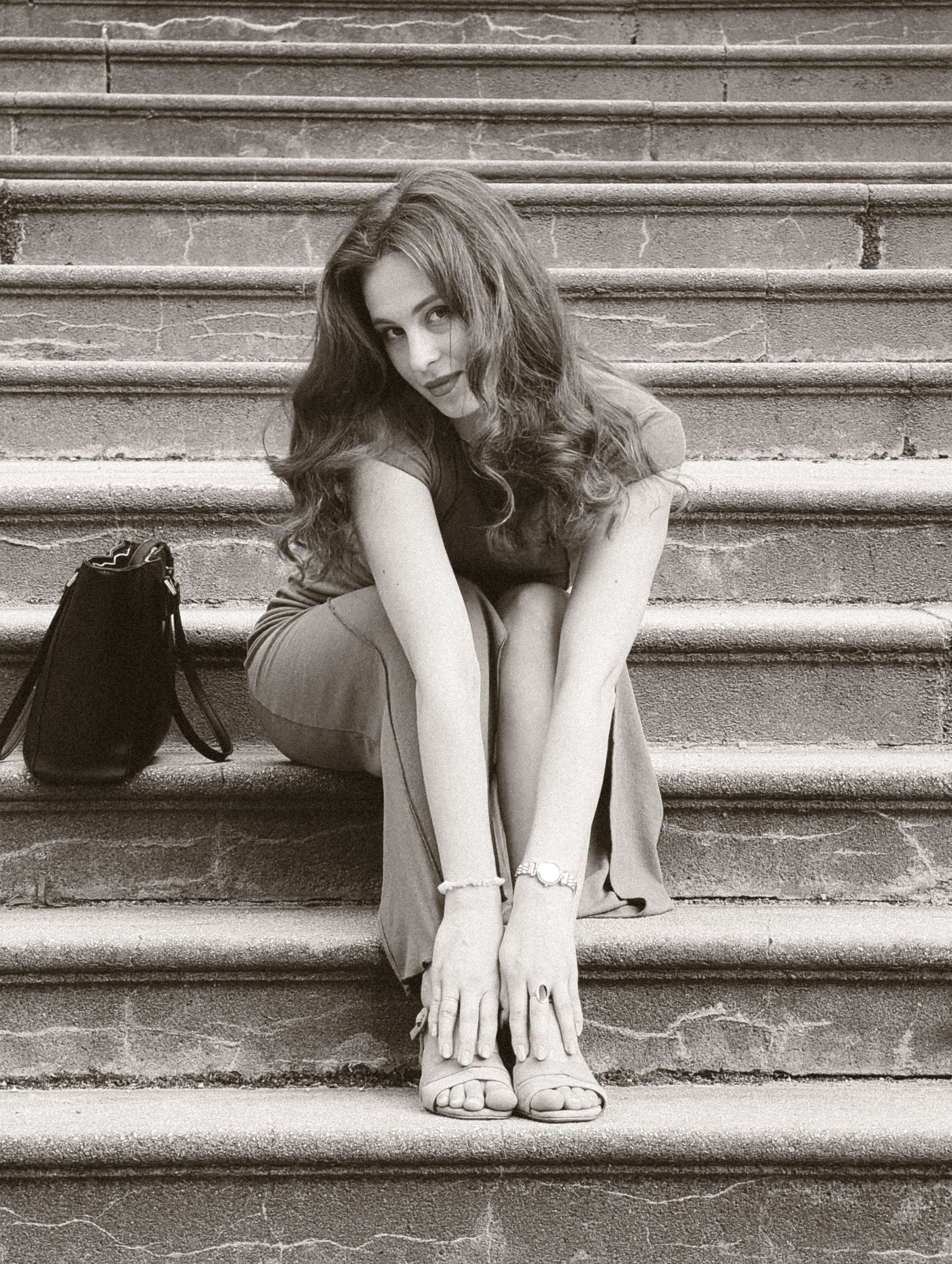 Young Woman Sitting on Marble Steps in Bayreuth · Free Stock Photo