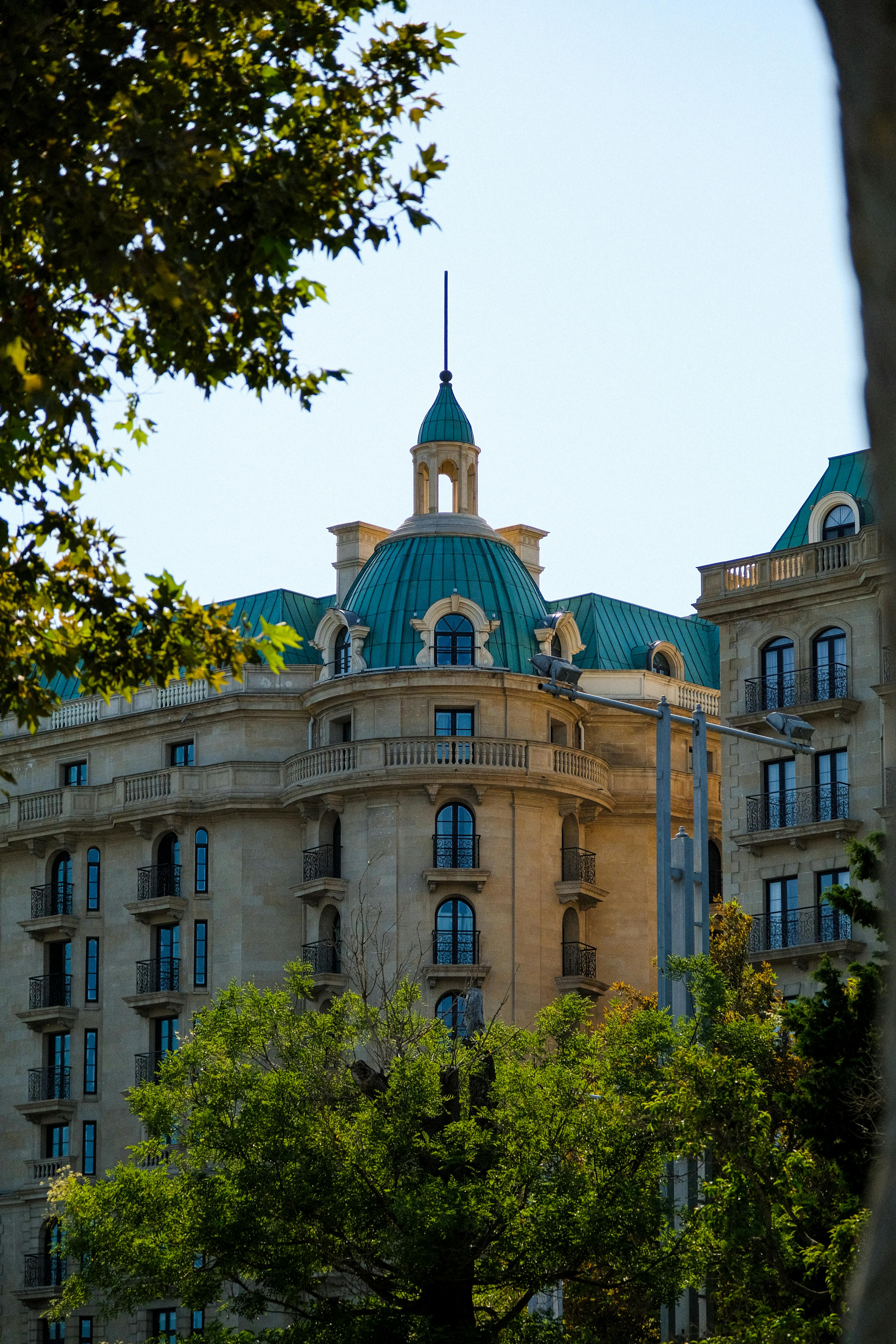 Elegant Architectural Building with Green Domes · Free Stock Photo