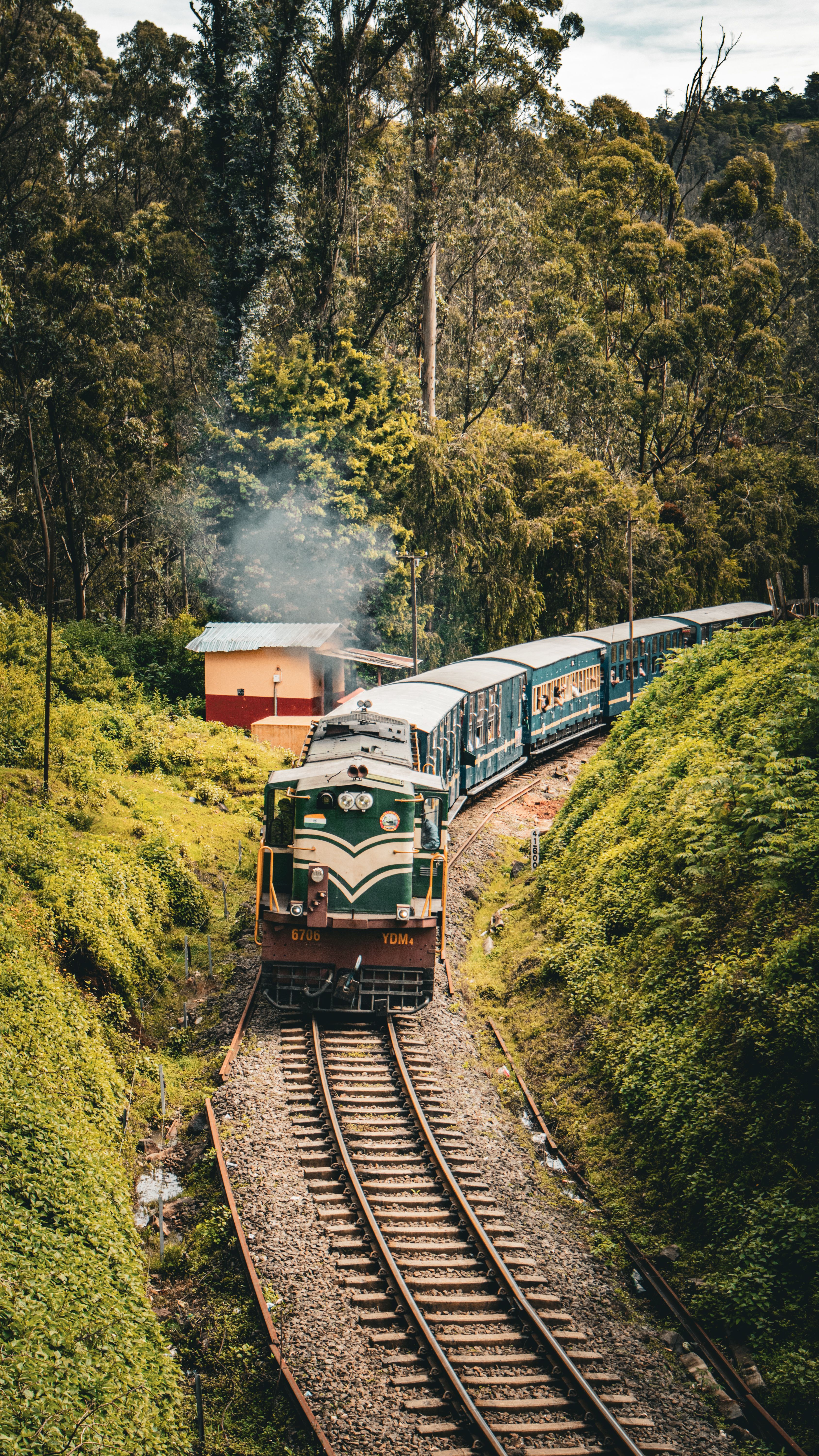 Photo Of Railway On Mountain Near Houses · Free Stock Photo