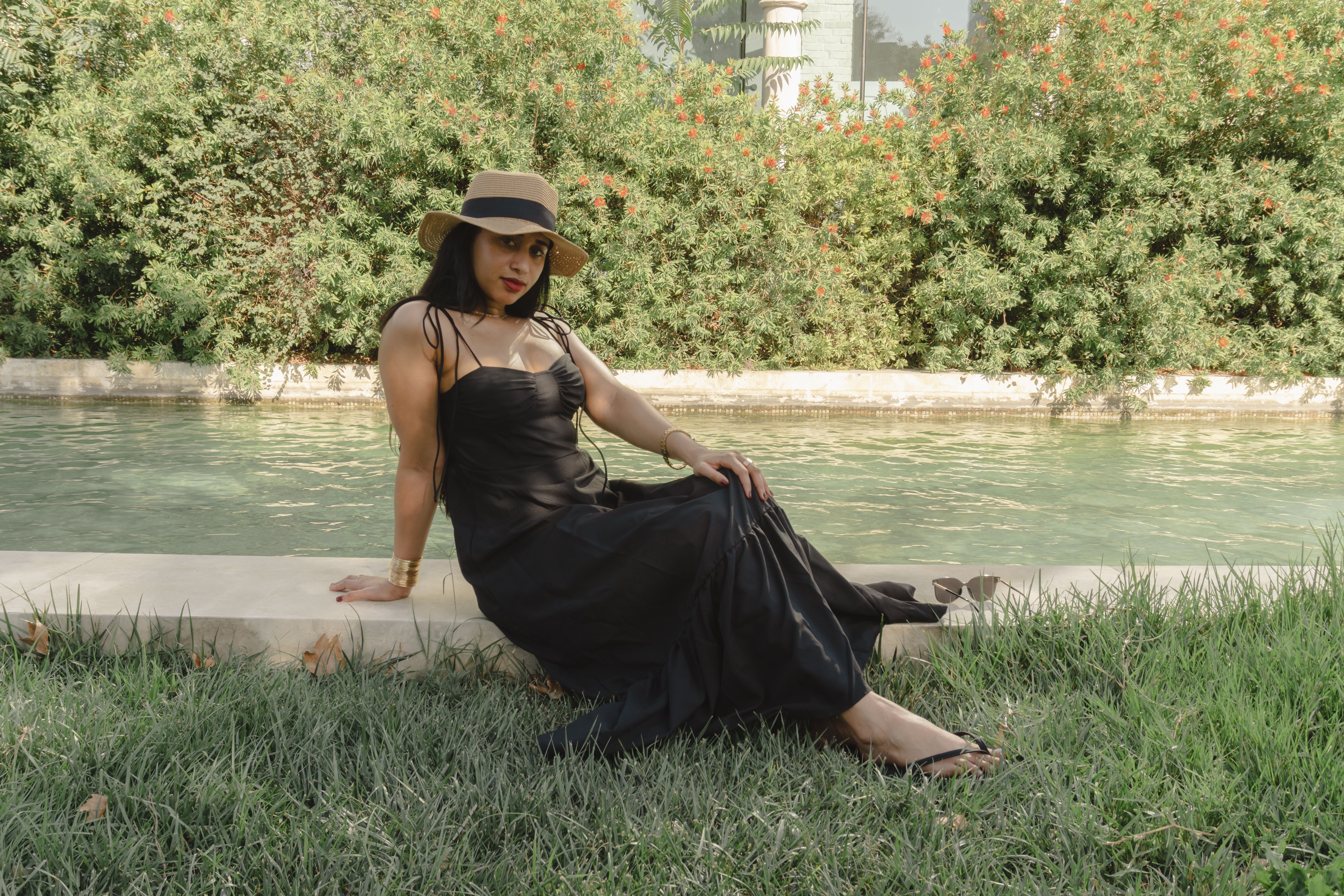 Woman in Black Robe Standing Beside Pool · Free Stock Photo