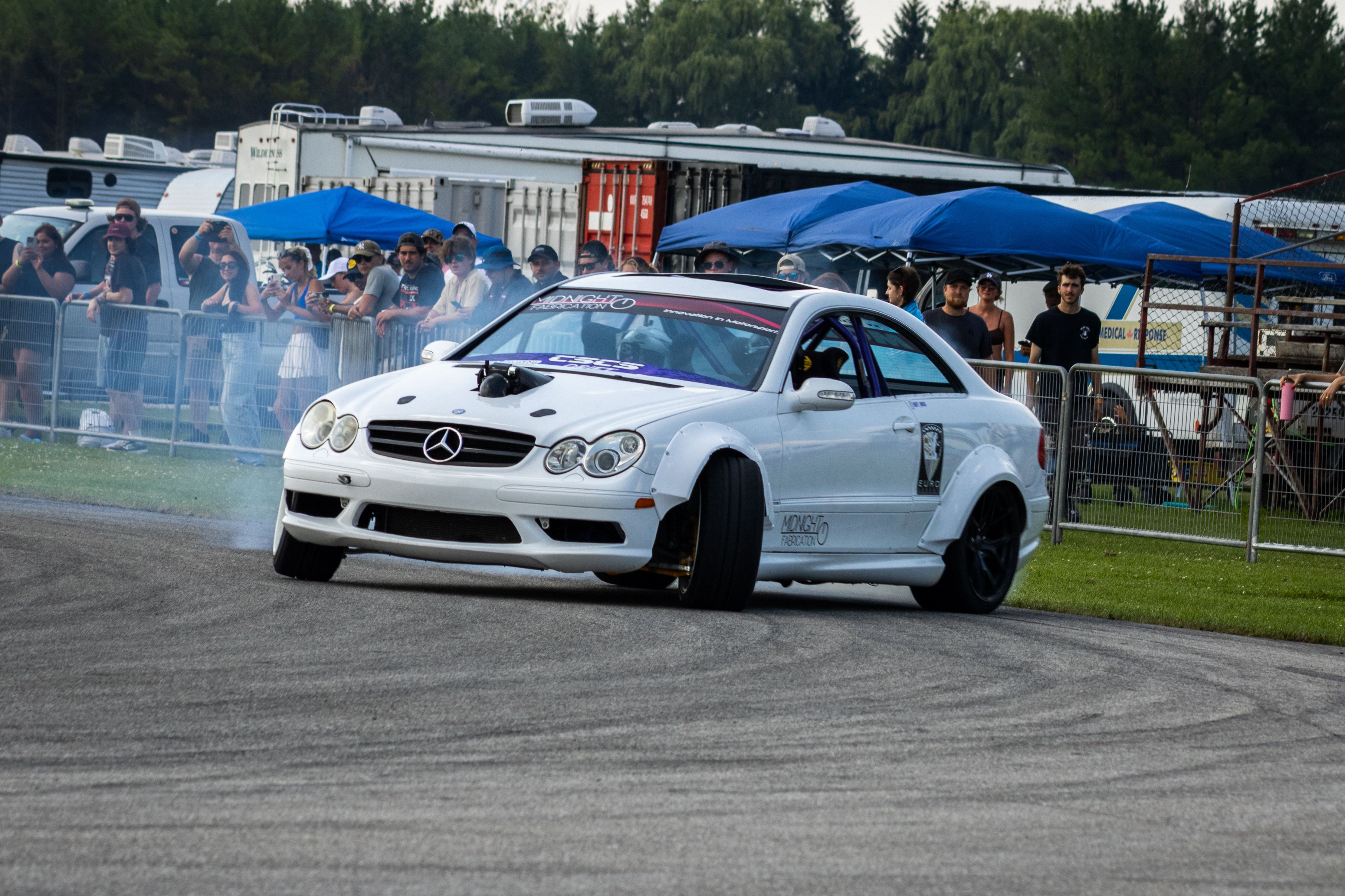 Dynamic BMW Drift Car on Race Track · Free Stock Photo