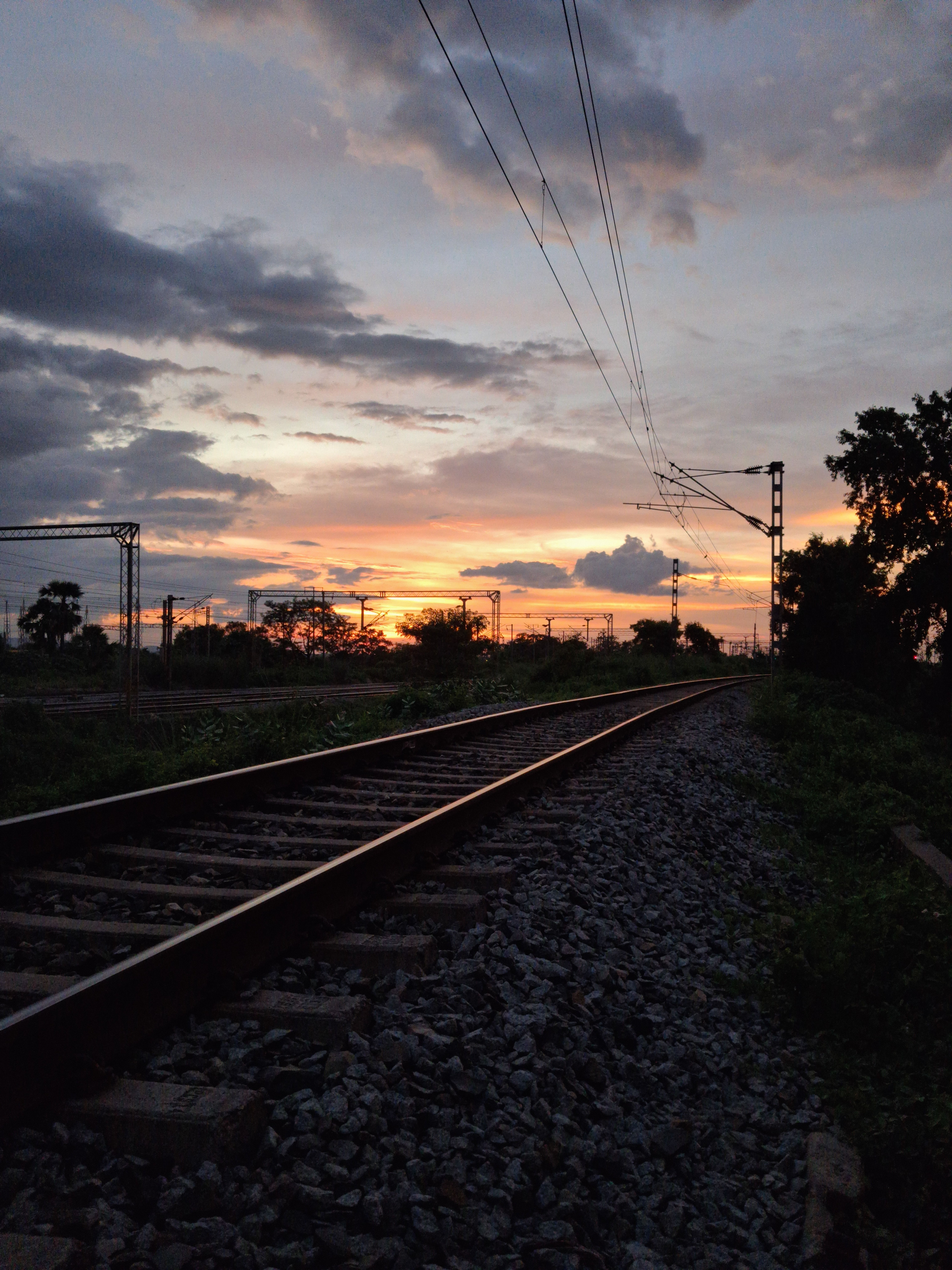 Scenic Sunset Over Railway Tracks · Free Stock Photo