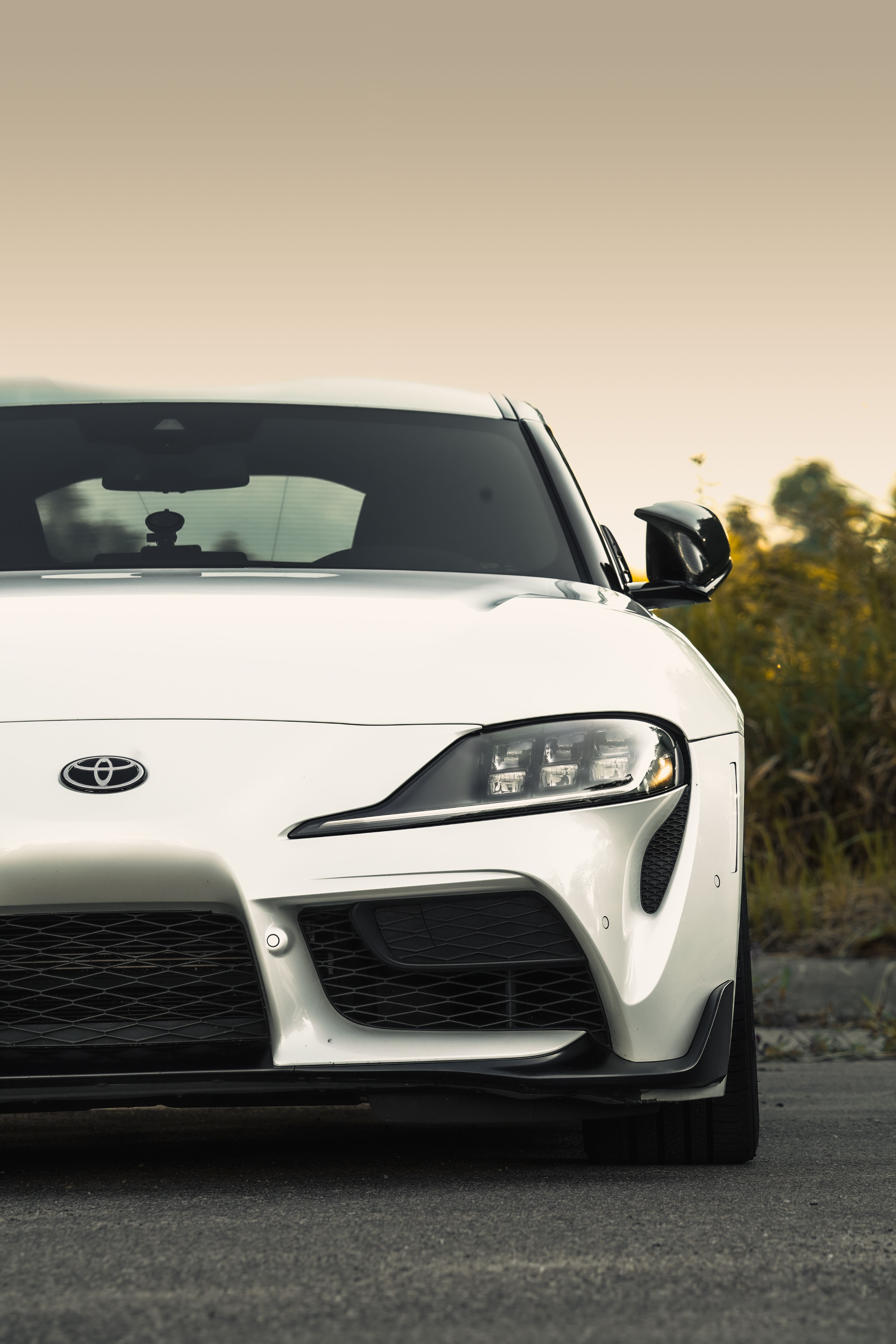 Silver Toyota Supra in Industrial Setting · Free Stock Photo