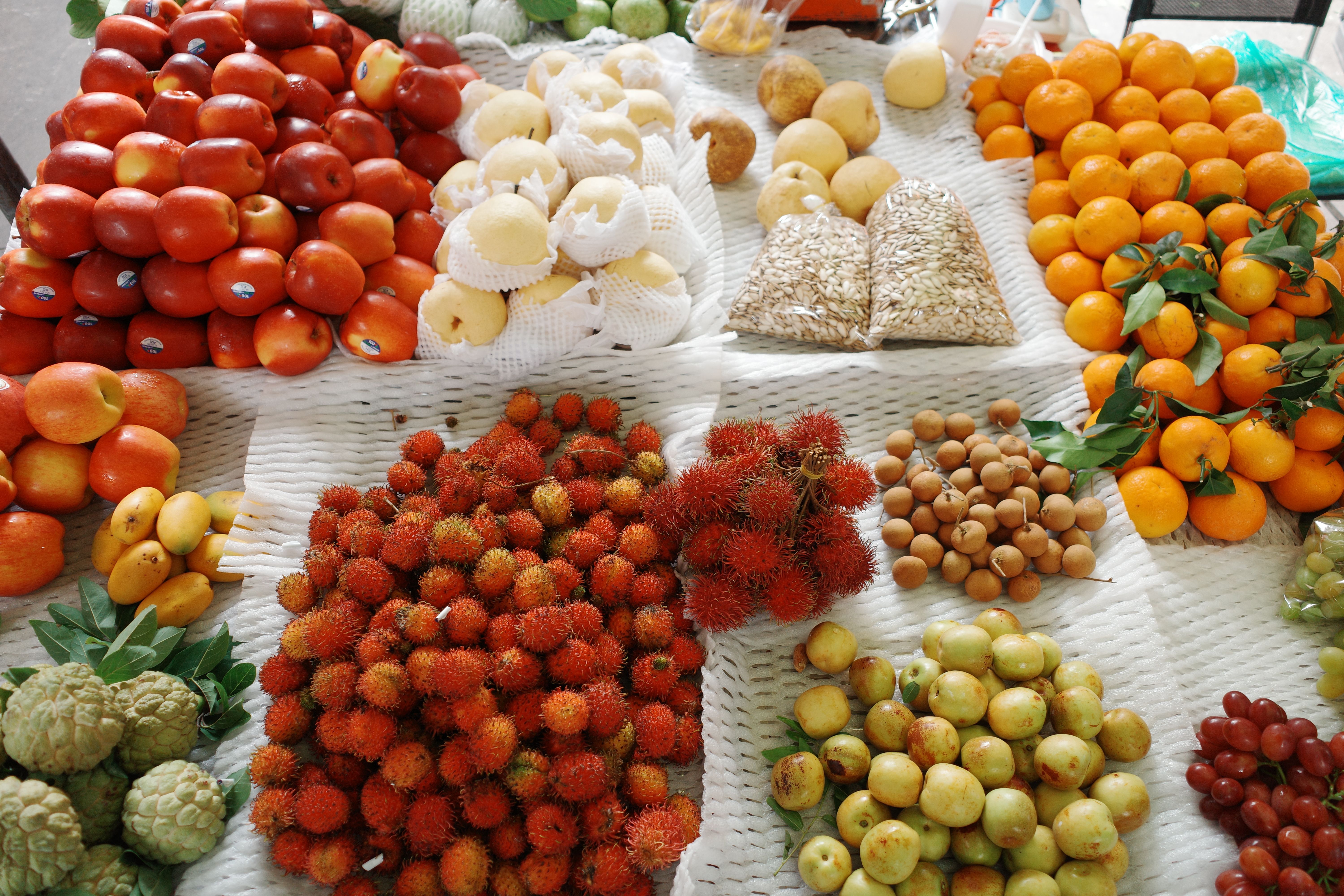 Vibrant Array of Fresh Tropical Fruits in Market · Free Stock Photo