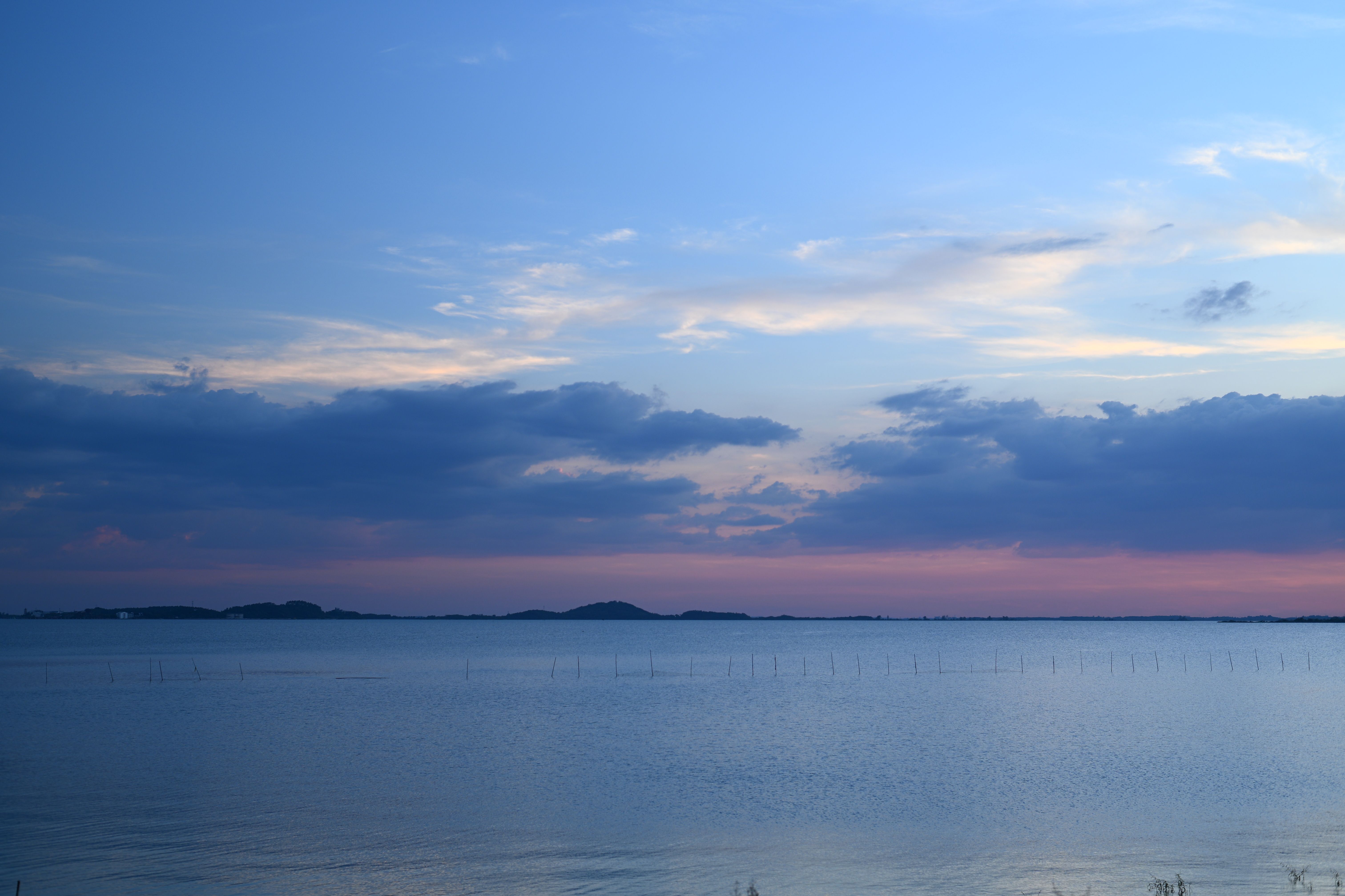 Tranquil Sunset Over Calm Ocean Waters · Free Stock Photo