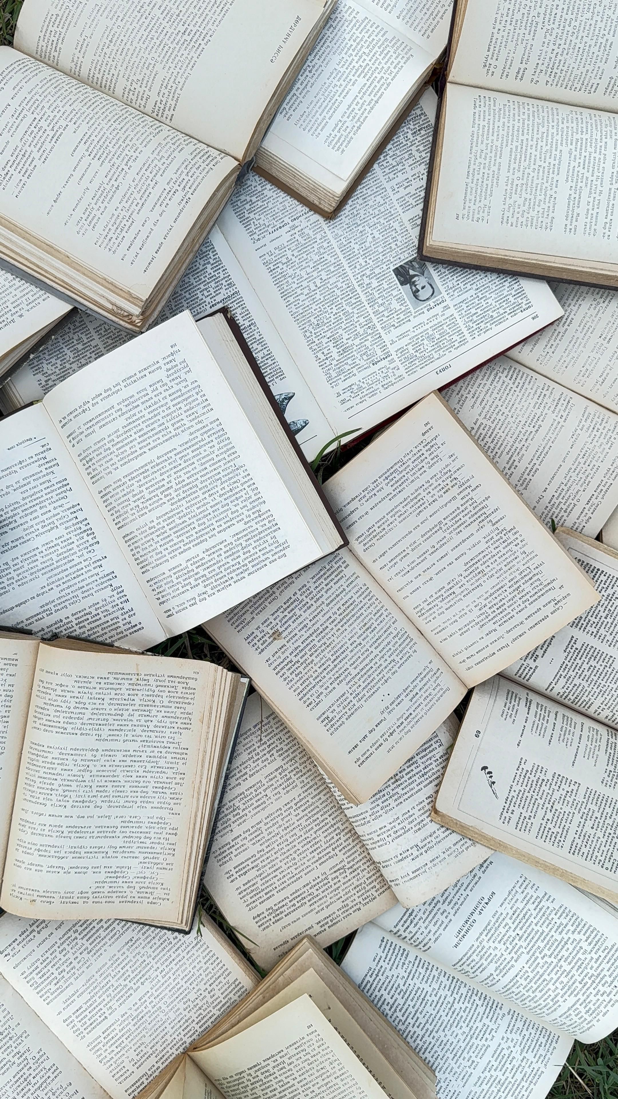Flat Lay of Vintage Open Books for Study · Free Stock Photo