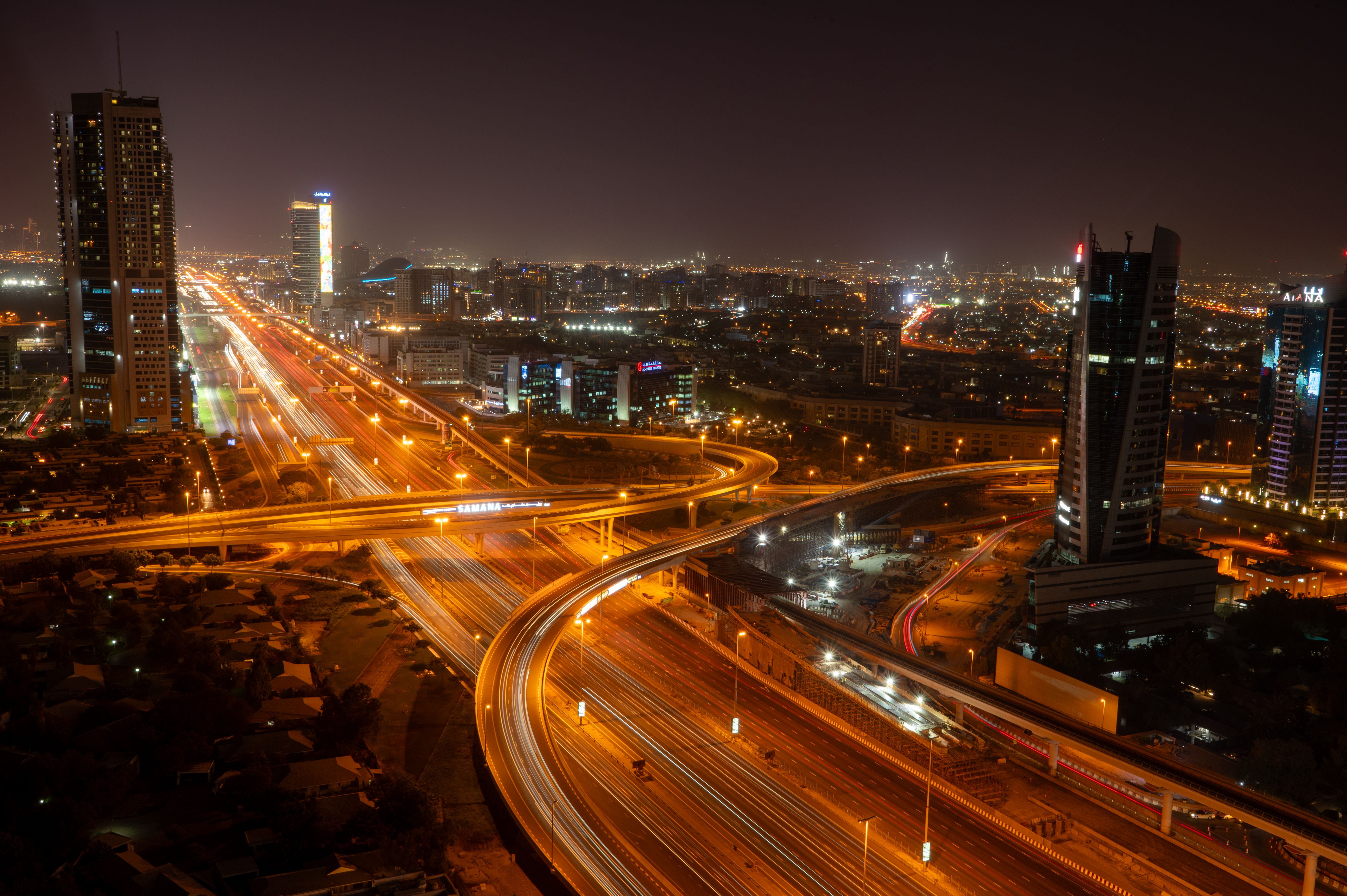 Stunning Dubai Night Cityscape with Illuminated Roads · Free Stock Photo