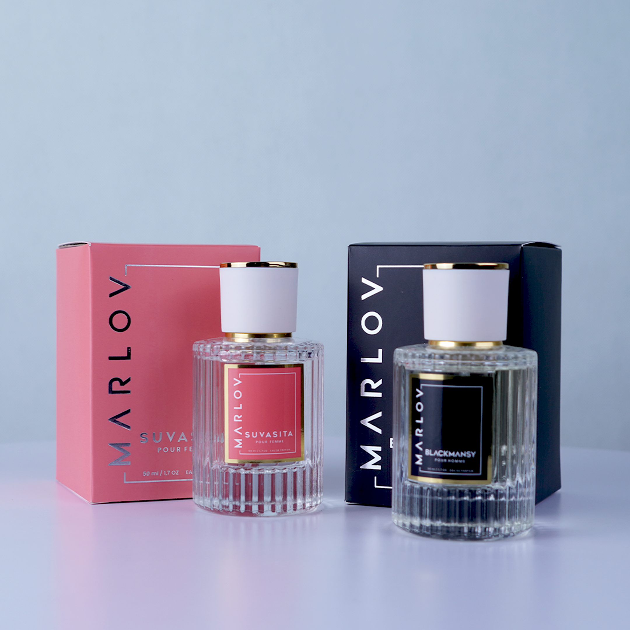 Elegant Perfume Bottles with Stylish Packaging · Free Stock Photo
