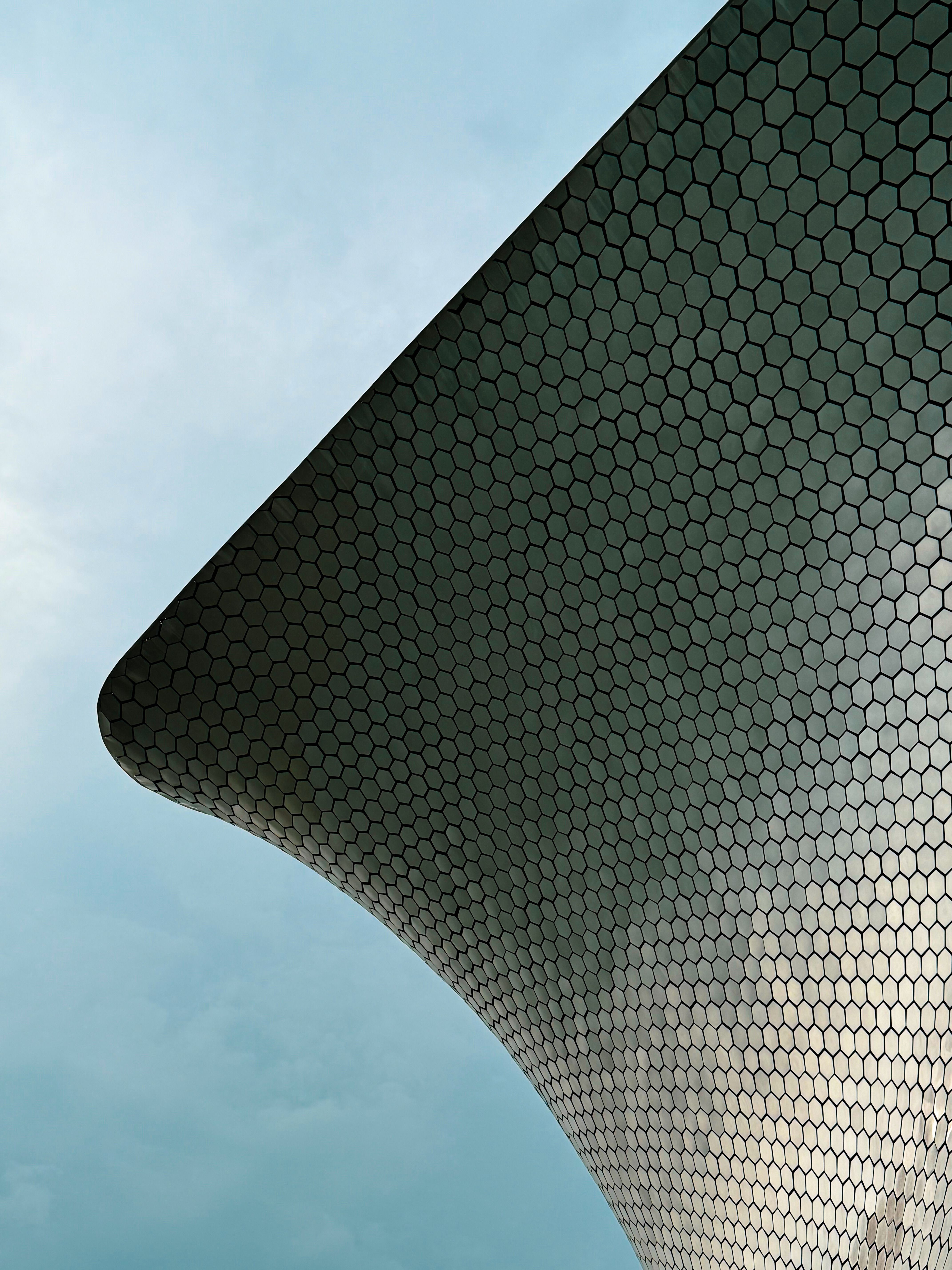 Modern Architectural Design with Hexagonal Facade · Free Stock Photo