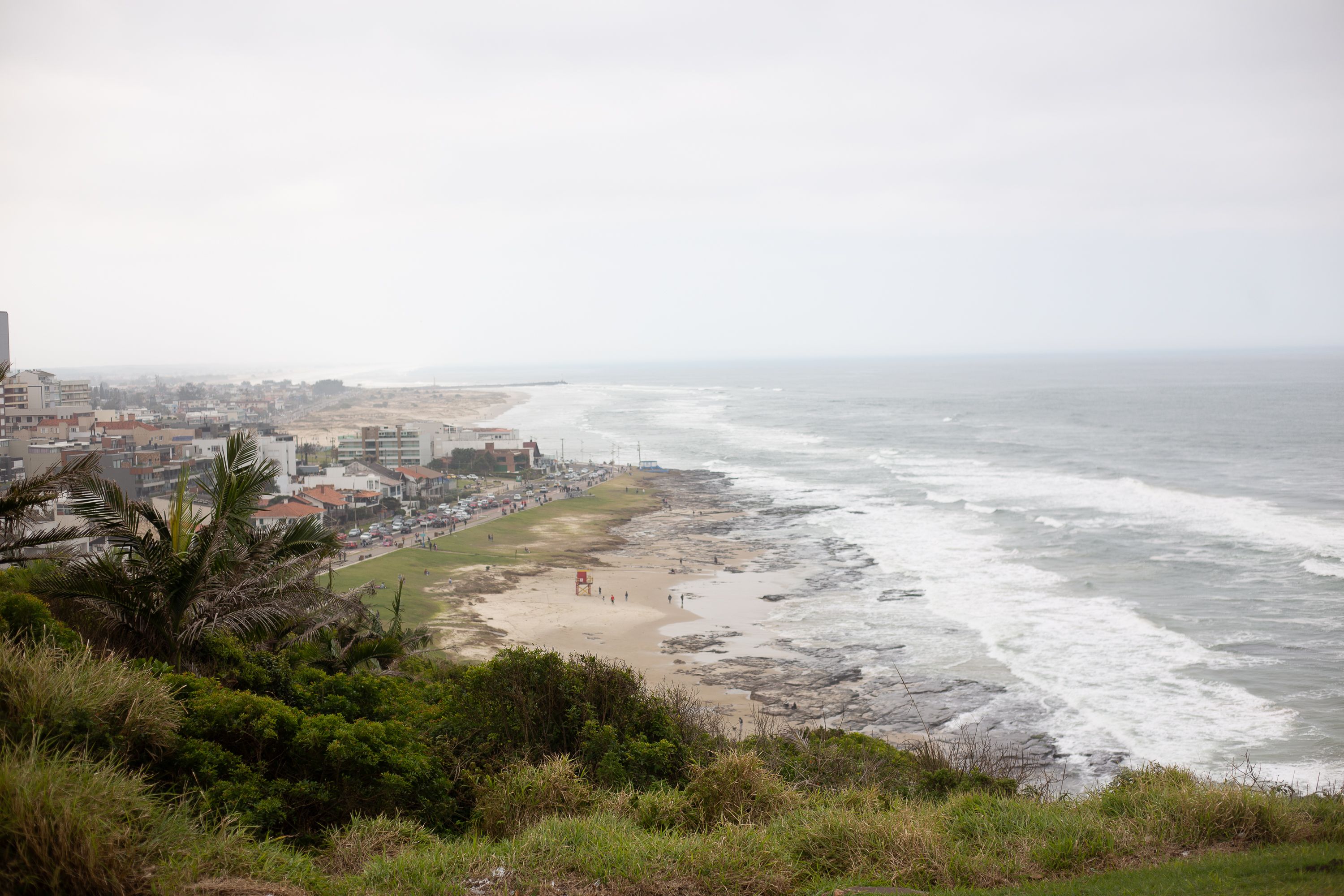 Scenic Beachfront View from Hilltop on Cloudy Day · Free Stock Photo