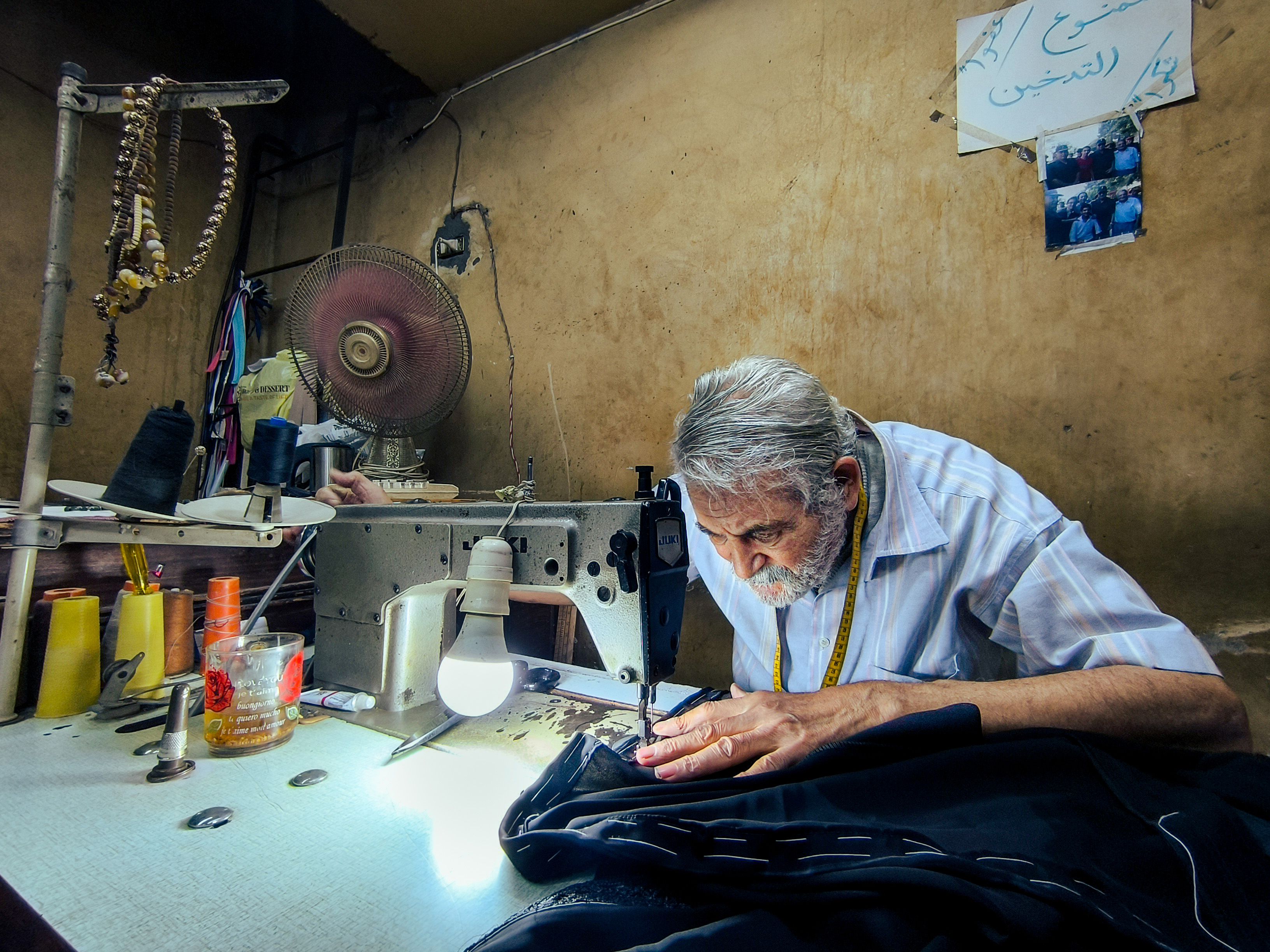 Photo of Man Sewing · Free Stock Photo