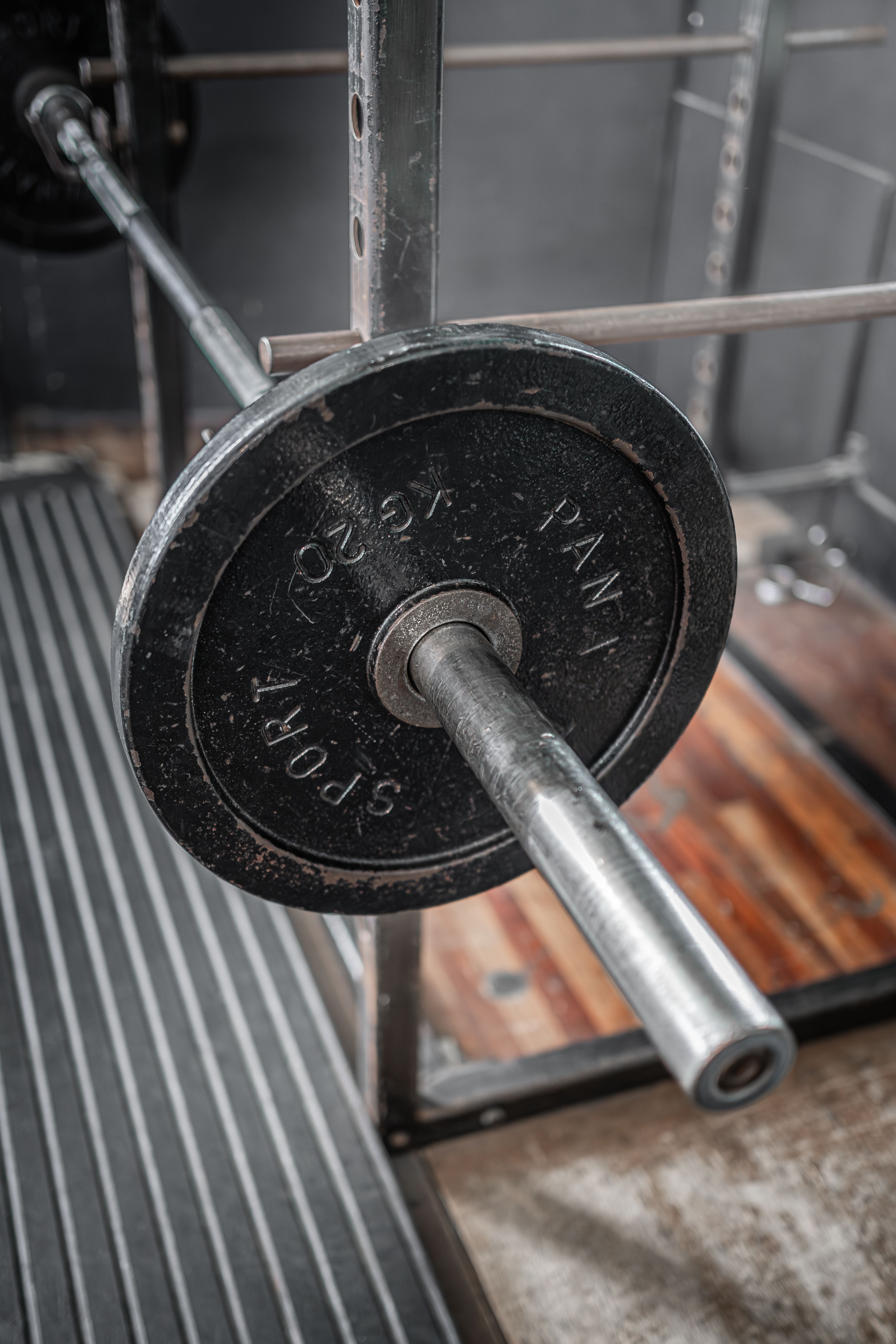 Barbell in a Modern Gym Setting · Free Stock Photo