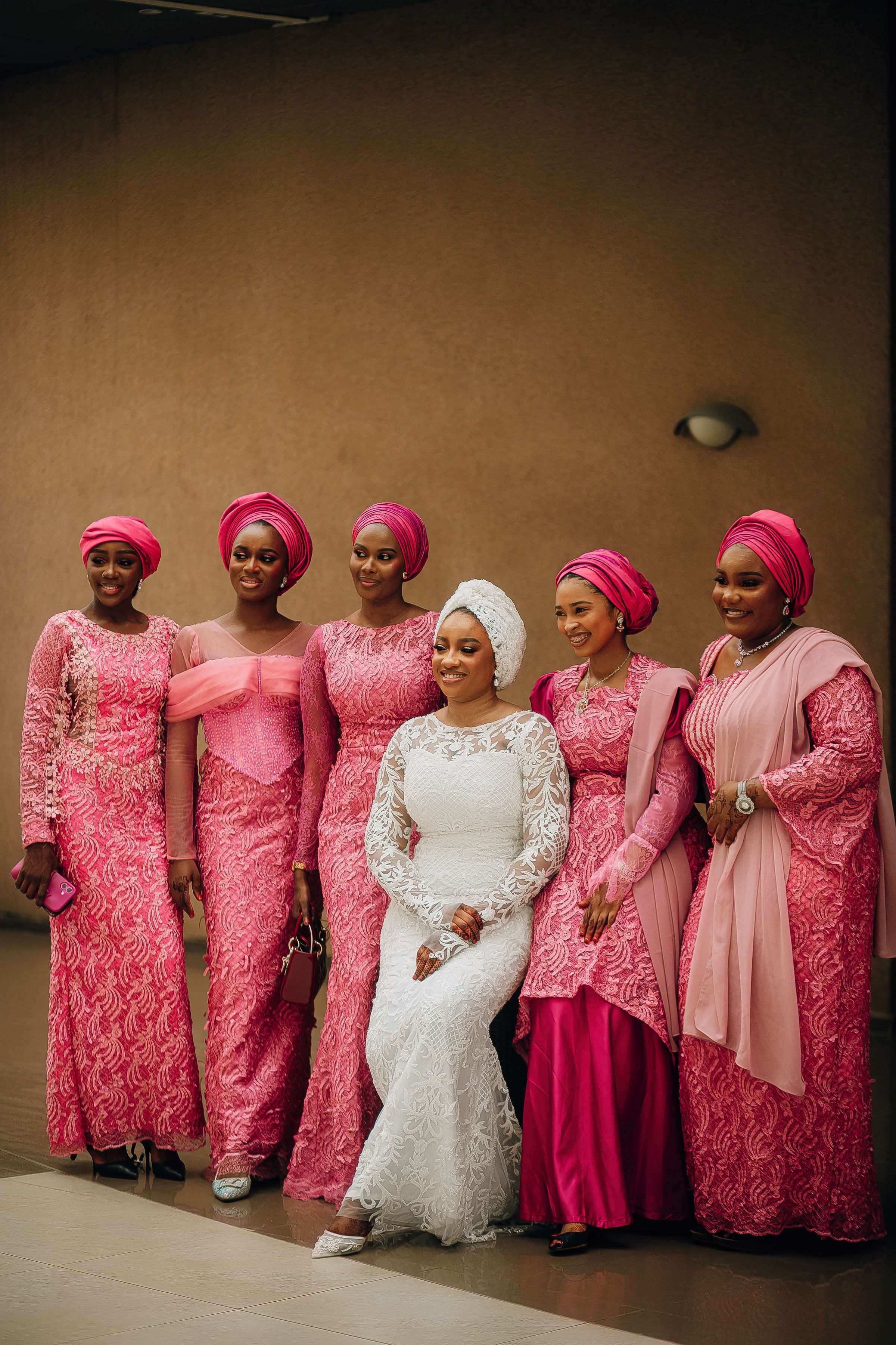 Elegant Bridal Party in Traditional Pink Attire · Free Stock Photo