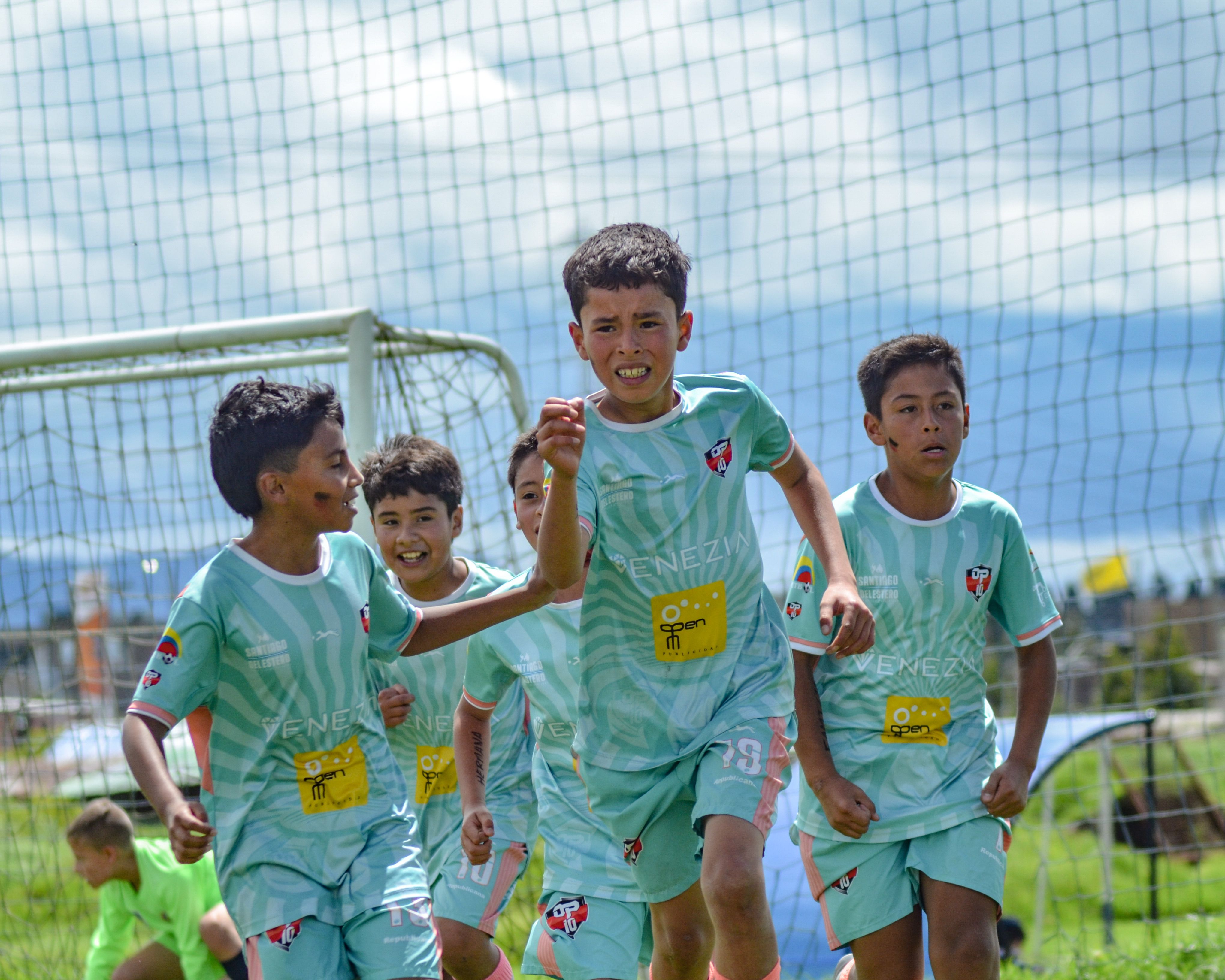 Youth Soccer Team Celebrating a Goal Outdoors · Free Stock Photo