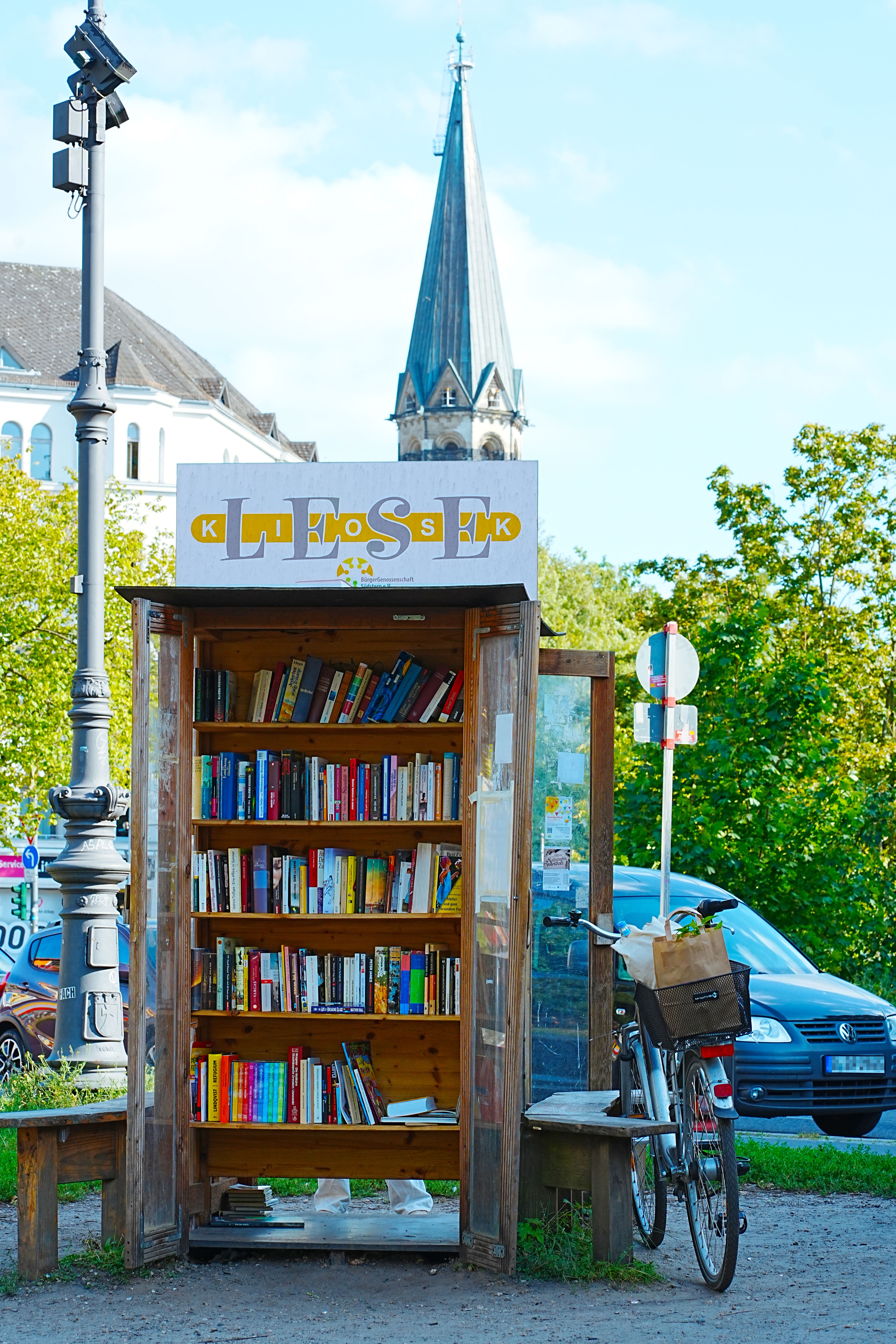 Rustic Street Library Booth with Bicycle · Free Stock Photo