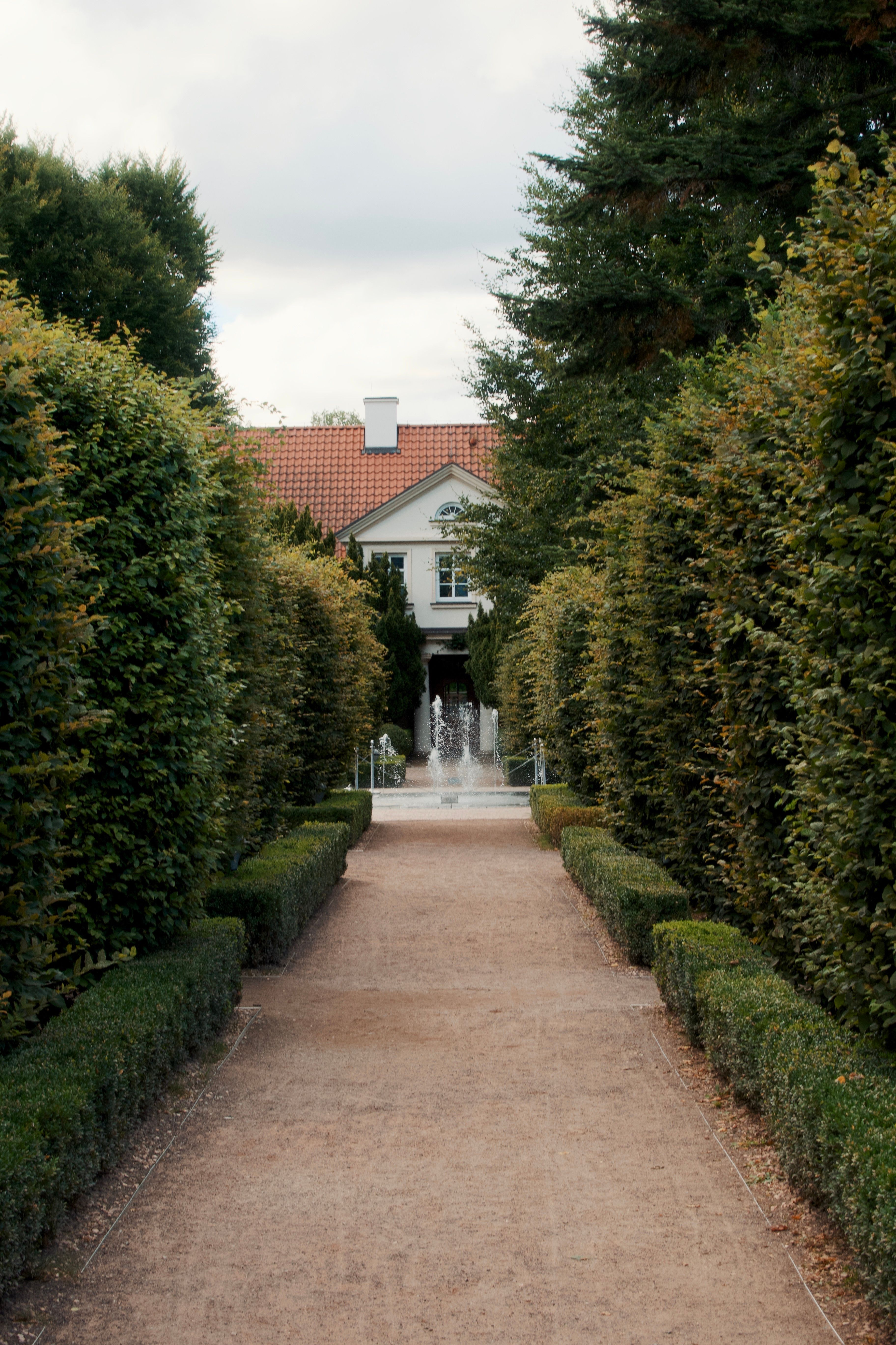 Scenic Pathway Leading to Classic Estate House · Free Stock Photo