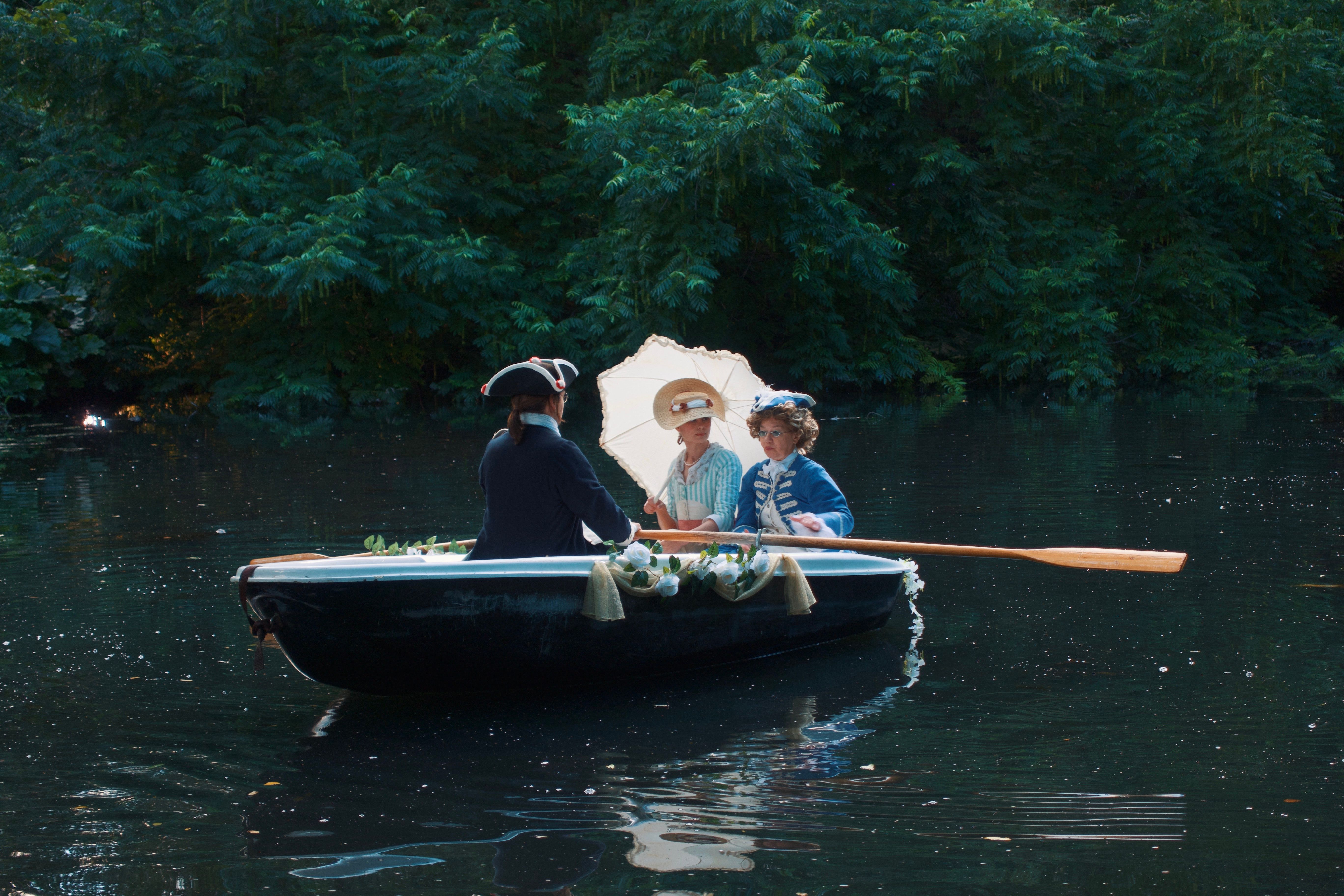 Elegant Historical Boating Scene in Serene River · Free Stock Photo