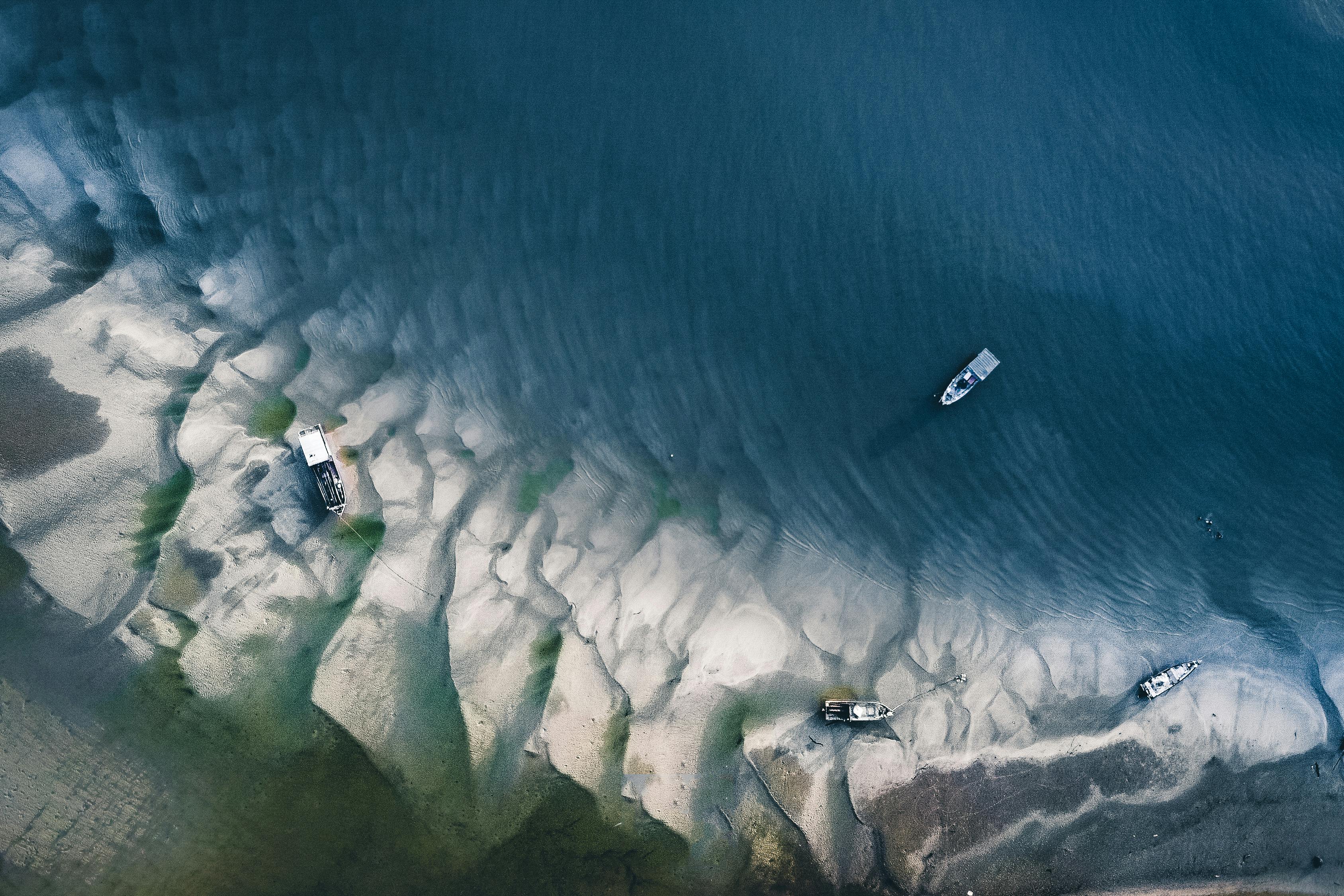 Top View Photo Of Boat On Sea · Free Stock Photo