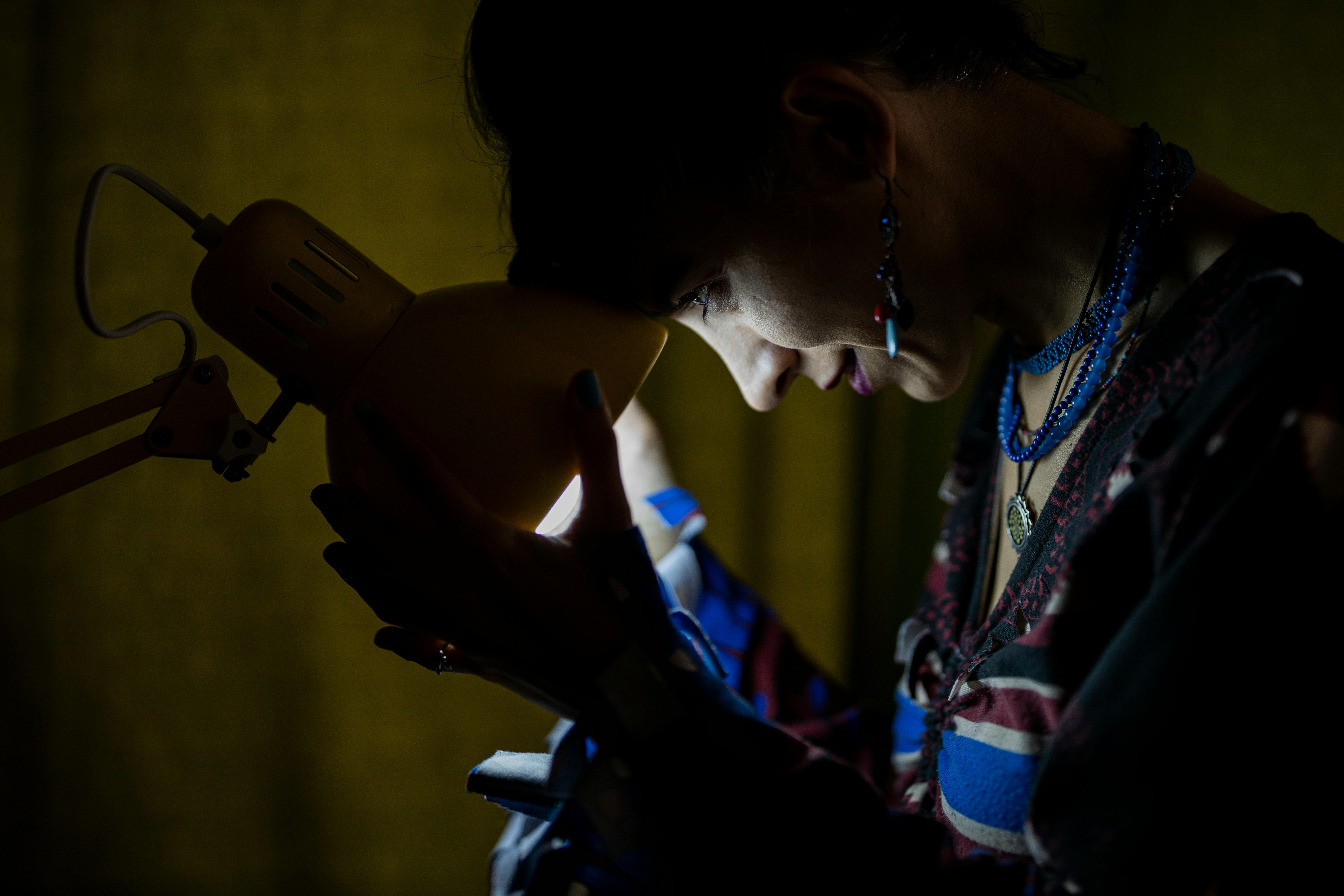 Woman Holding Desk Lamp · Free Stock Photo