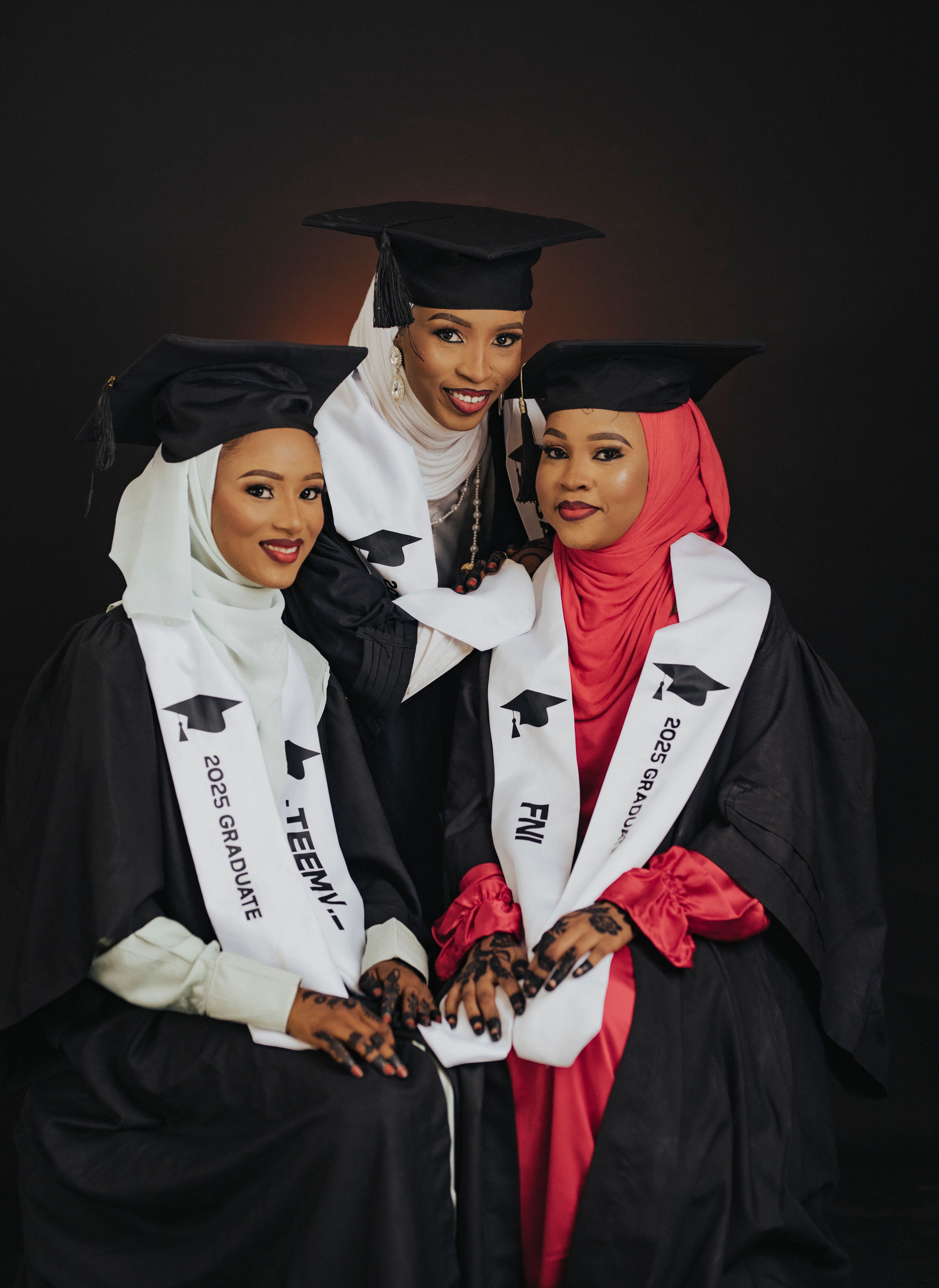 Elegant Portrait of Three Female Graduates in Caps and Gowns · Free ...