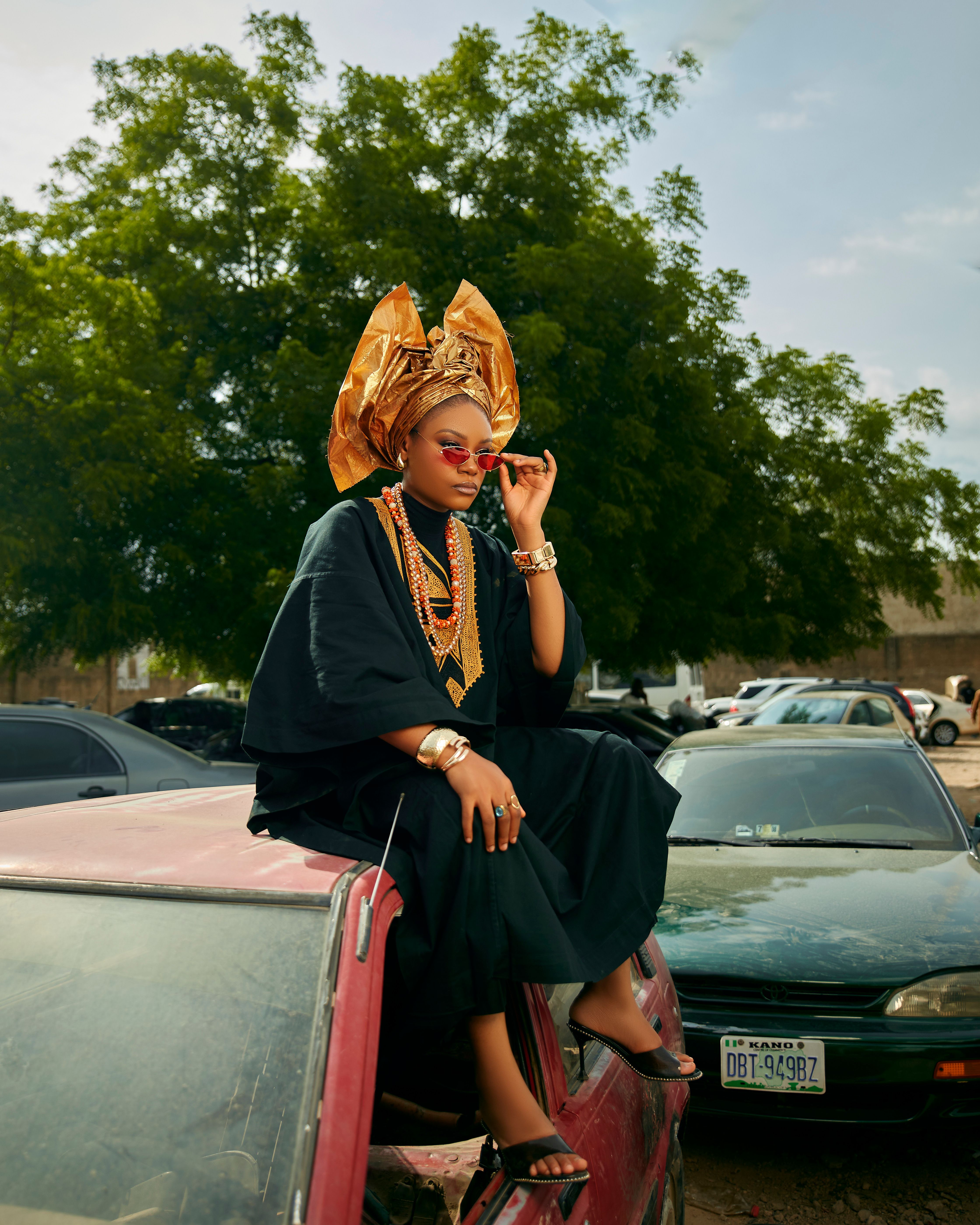 Fashionable Woman in Traditional Gele Headwrap · Free Stock Photo