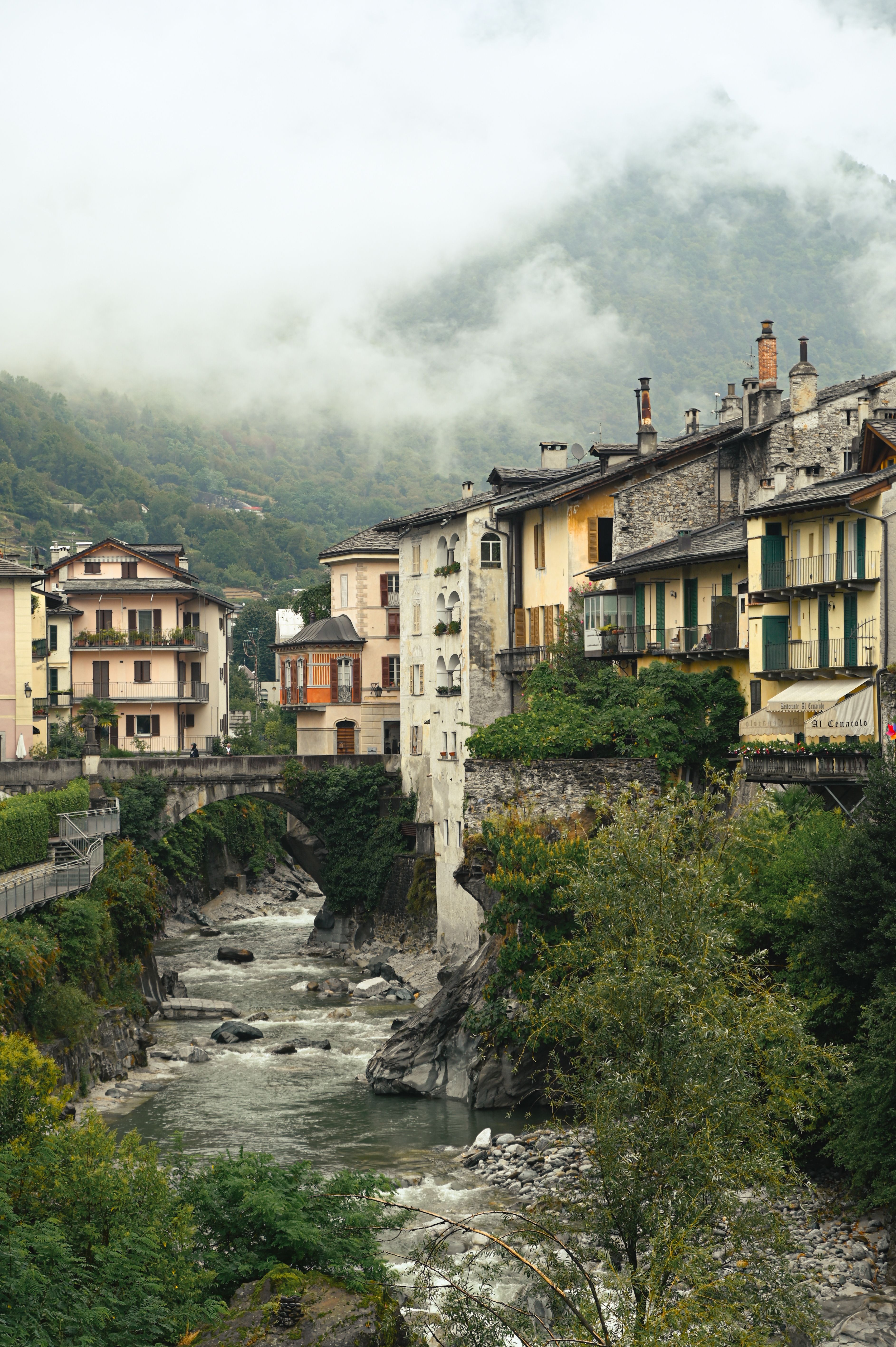 Charming Swiss Village with Historic Bridge · Free Stock Photo