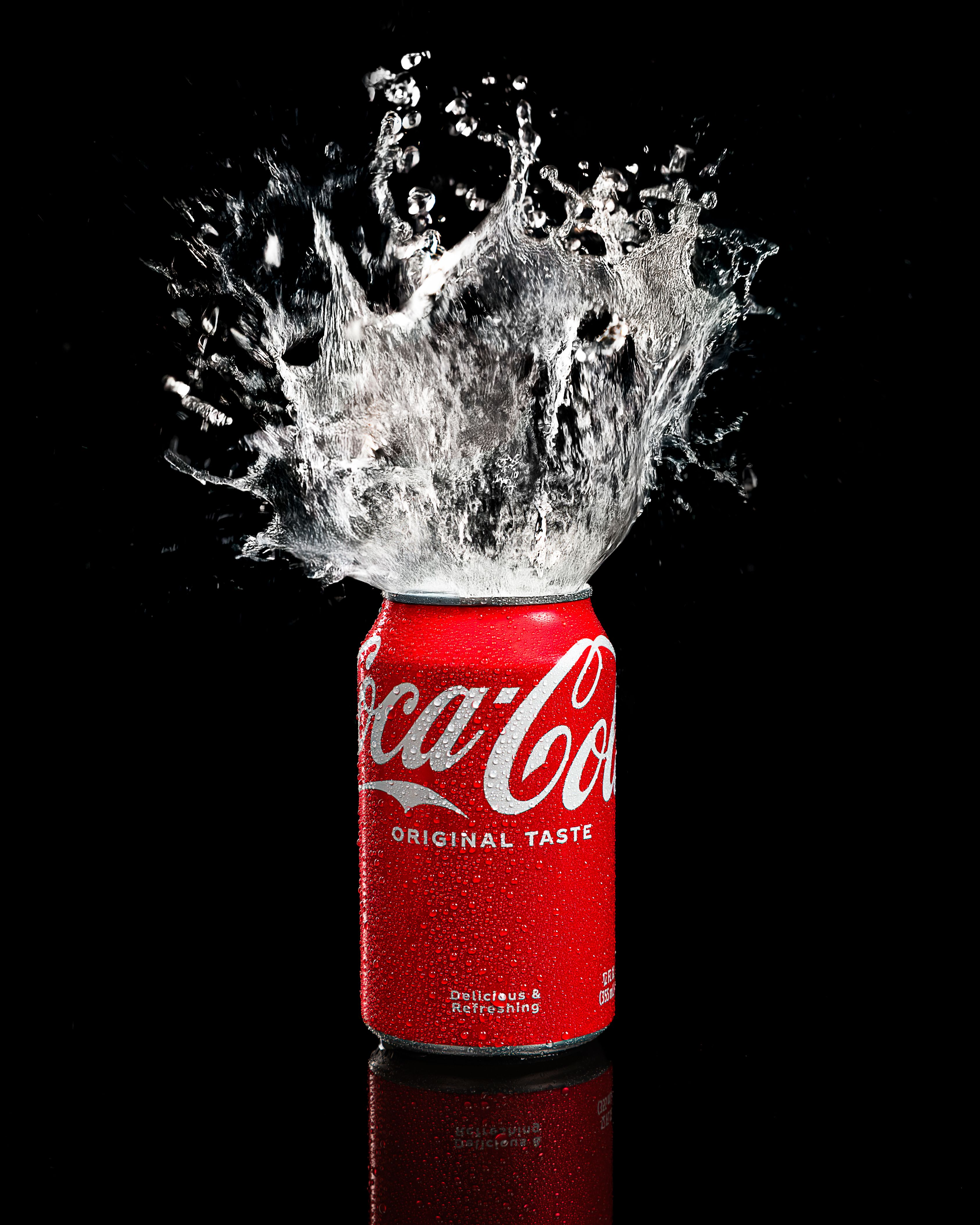 Dynamic Coca Cola Splash Photography in Studio · Free Stock Photo