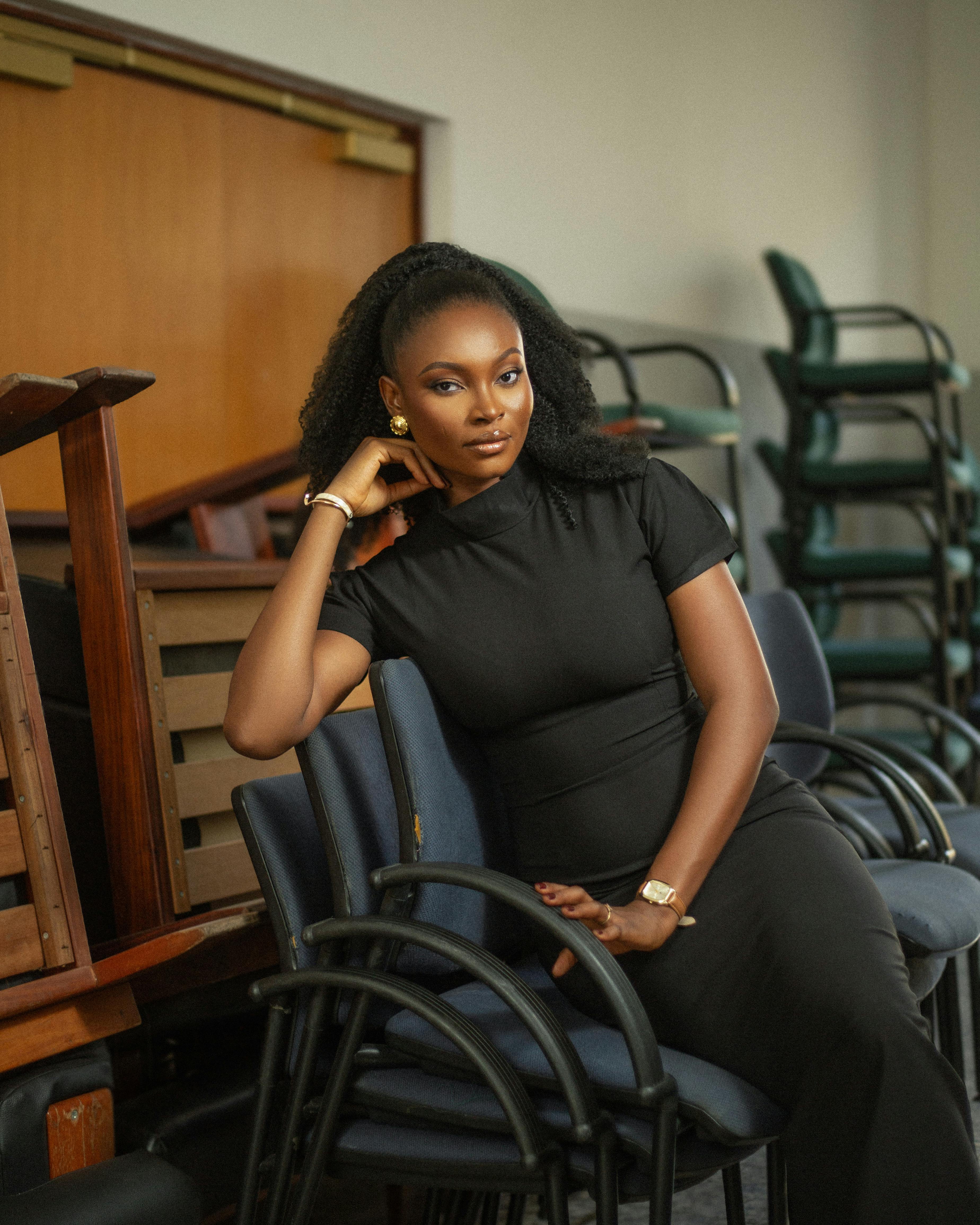 Elegant Woman Posing Indoors in Black Dress · Free Stock Photo