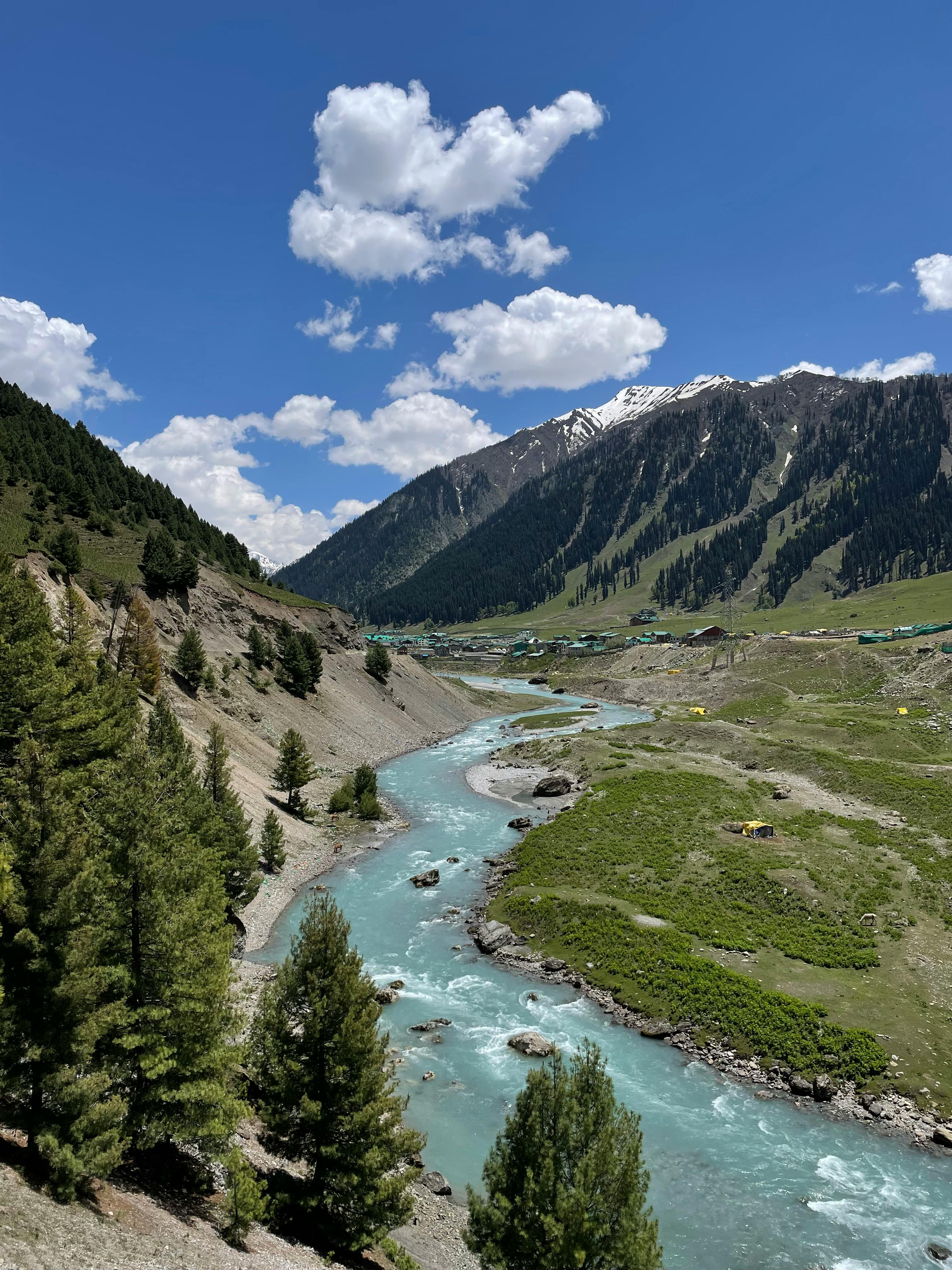 Scenic Mountain Stream in Lush Green Valley · Free Stock Photo