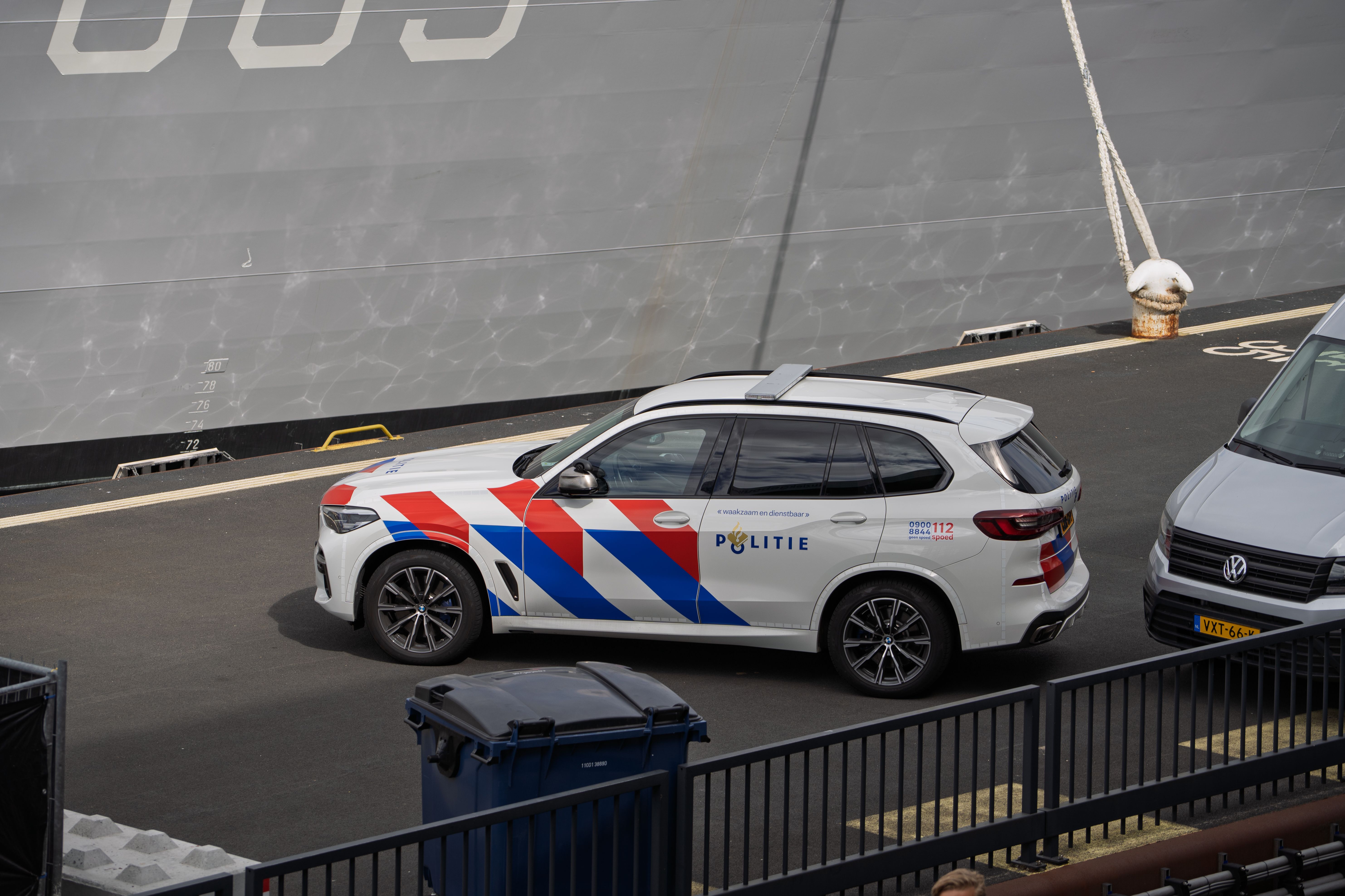 Dutch Police Car by Naval Ship Docked at Port · Free Stock Photo