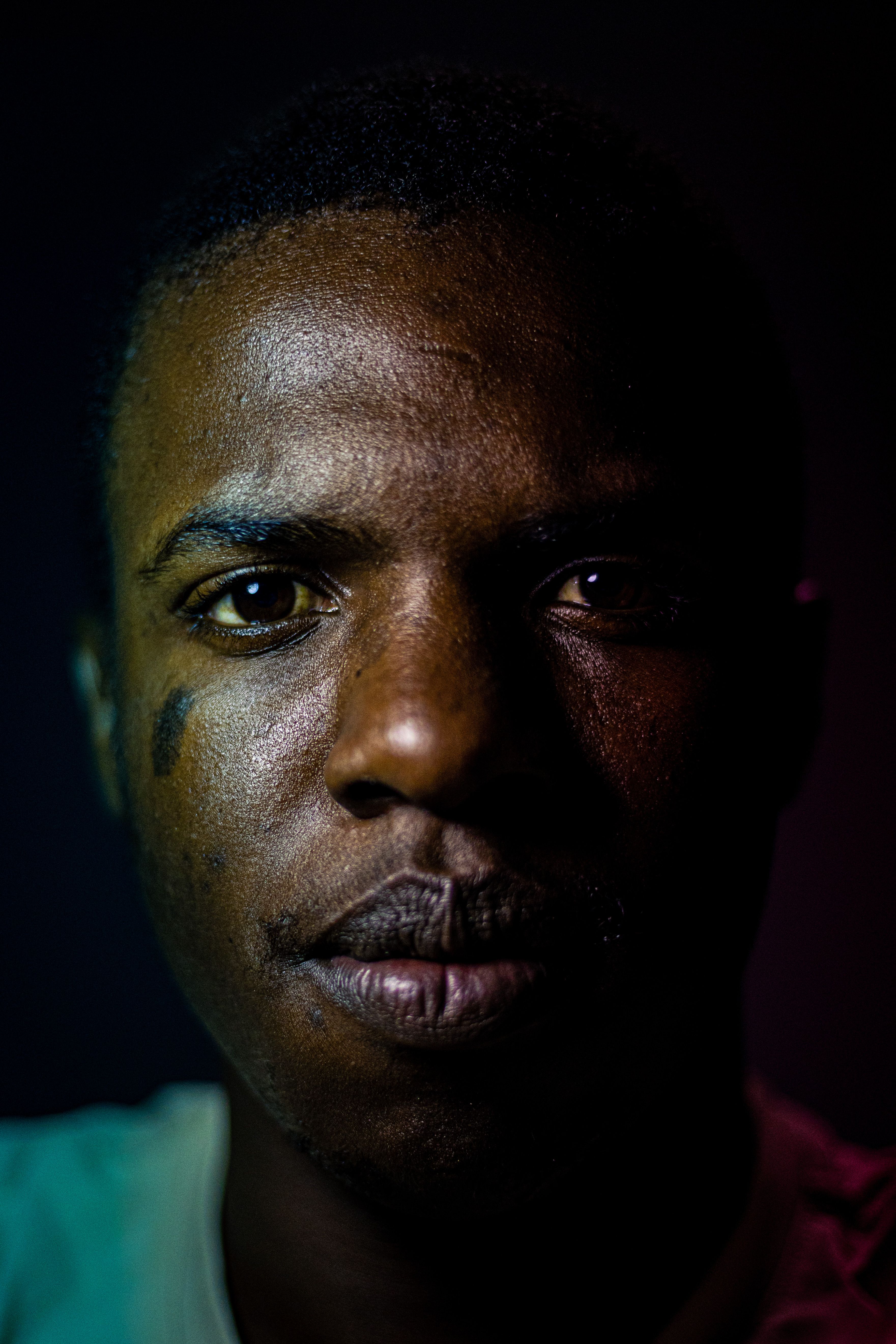 Expressive Portrait of a Man with Intense Lighting · Free Stock Photo