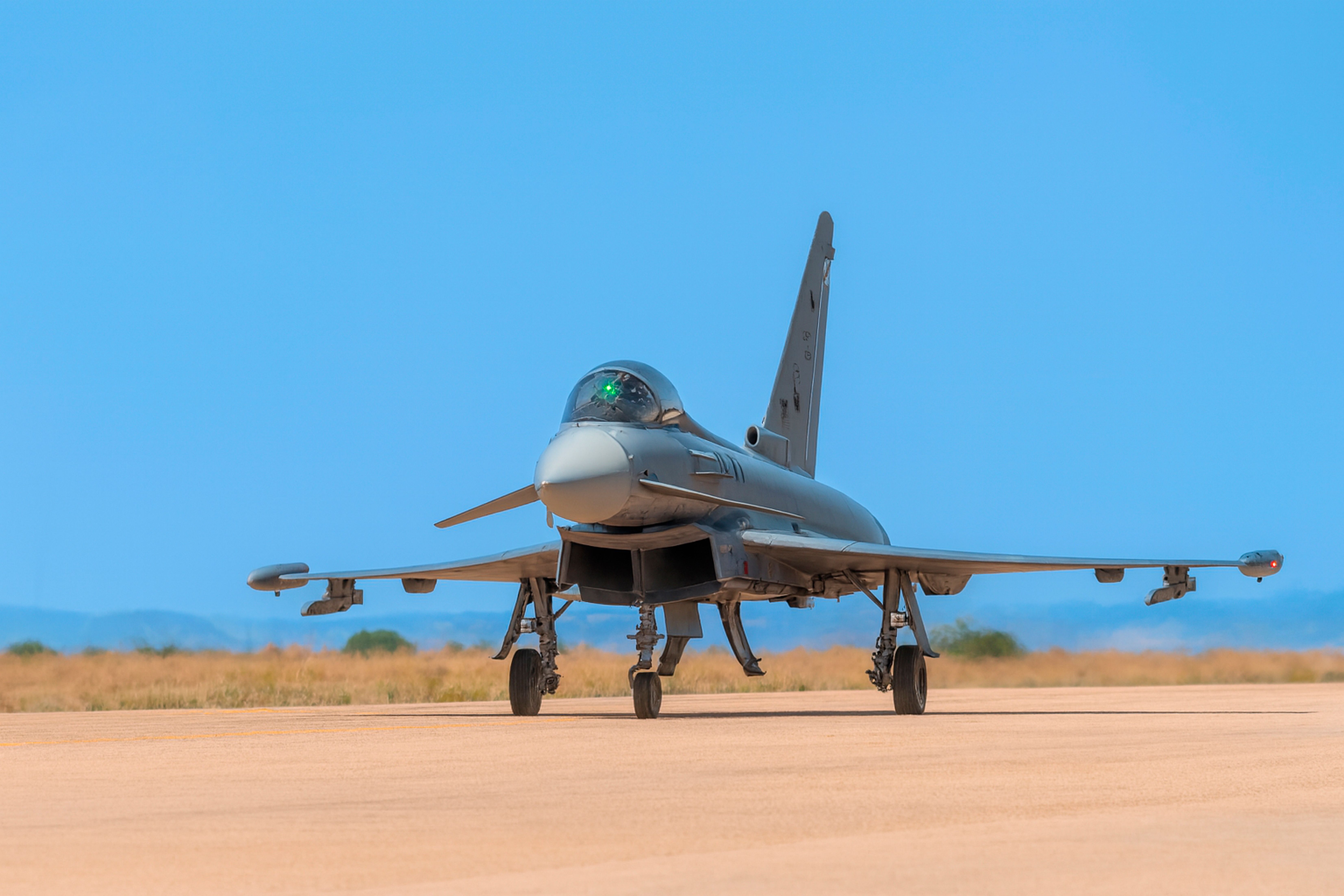 Jet Fighter Aircraft on Runway with Clear Blue Sky · Free Stock Photo