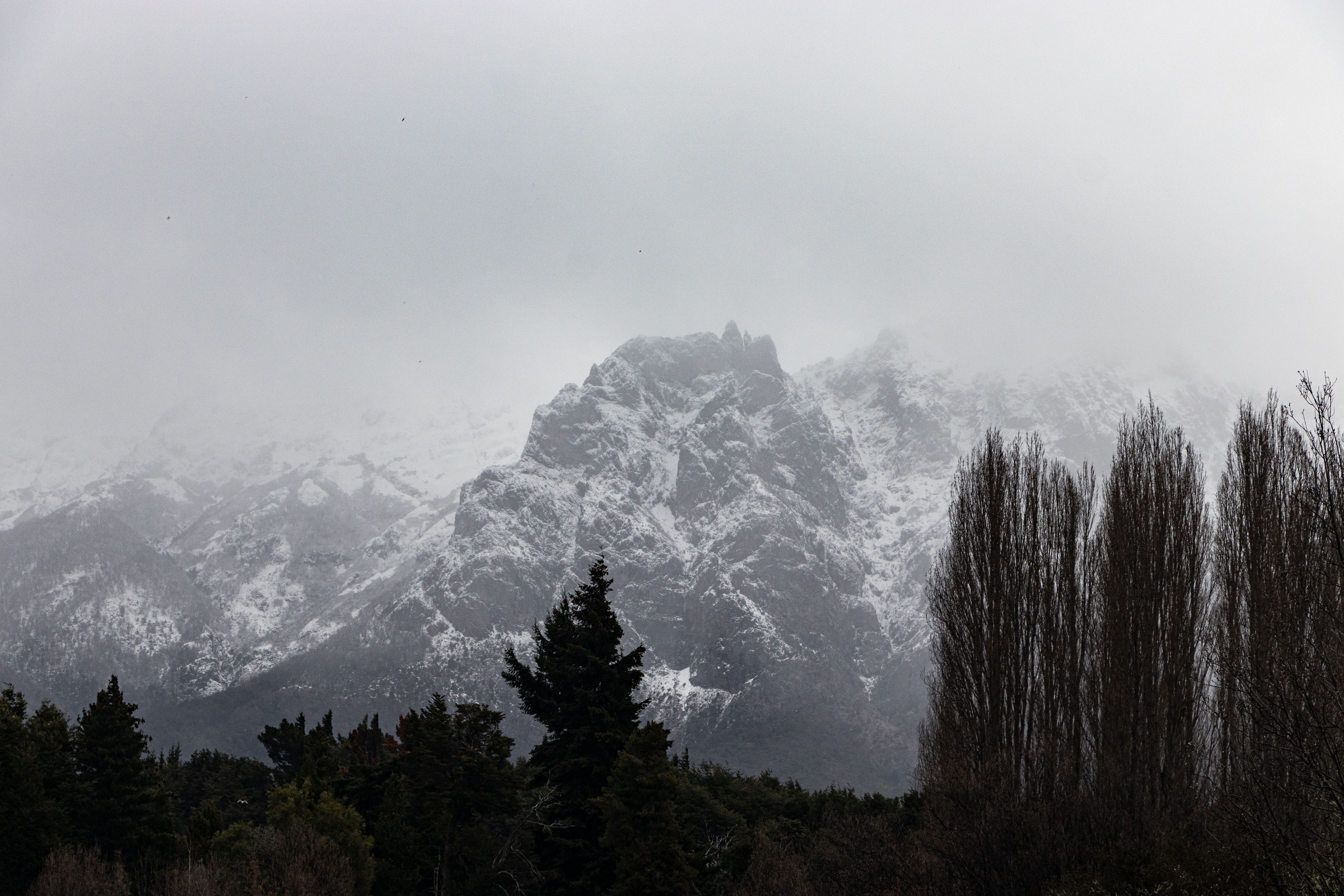 Majestic Snow-Capped Mountains in Misty Weather · Free Stock Photo