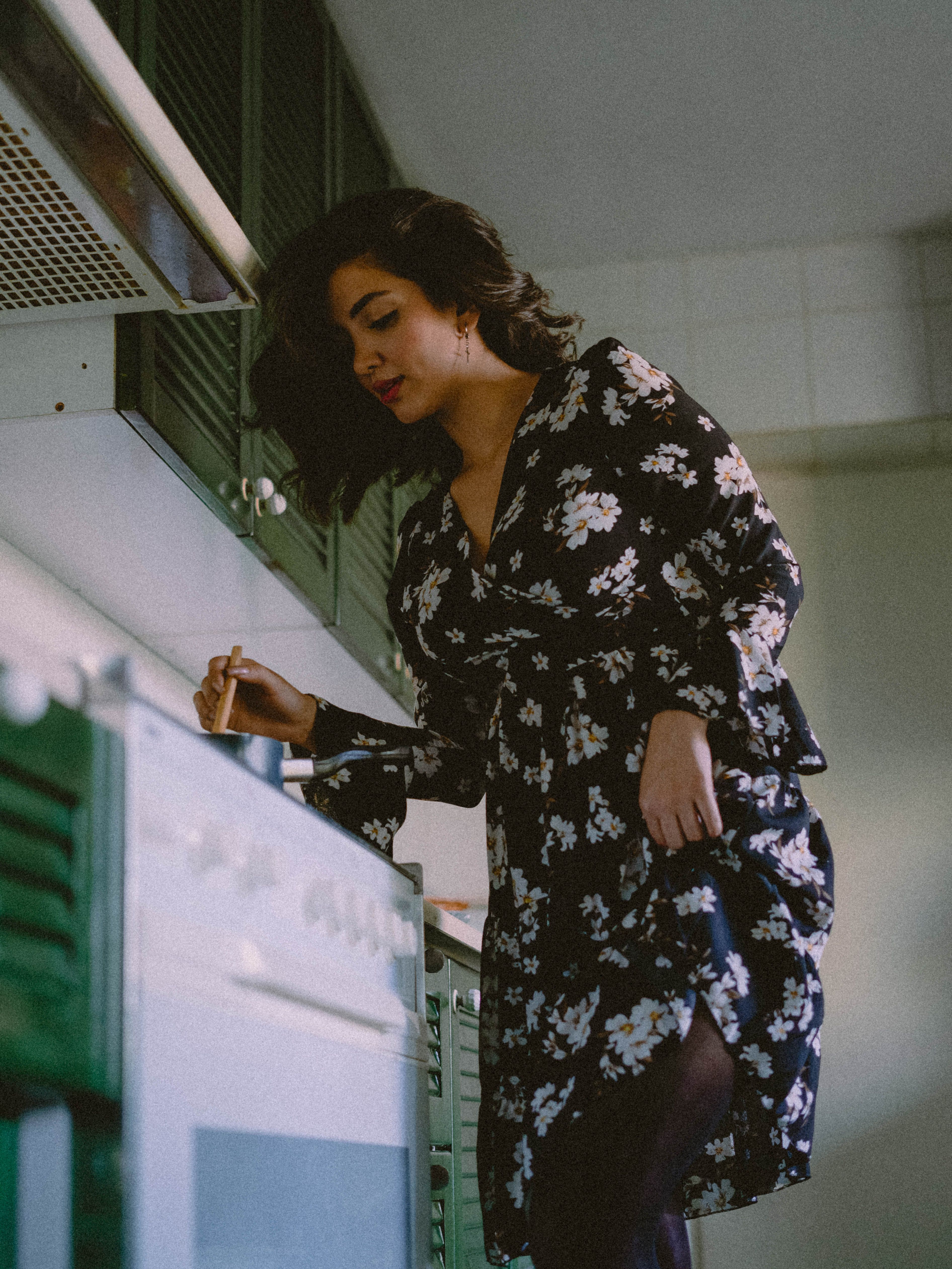 Woman Cooking in Floral Dress in Kitchen · Free Stock Photo