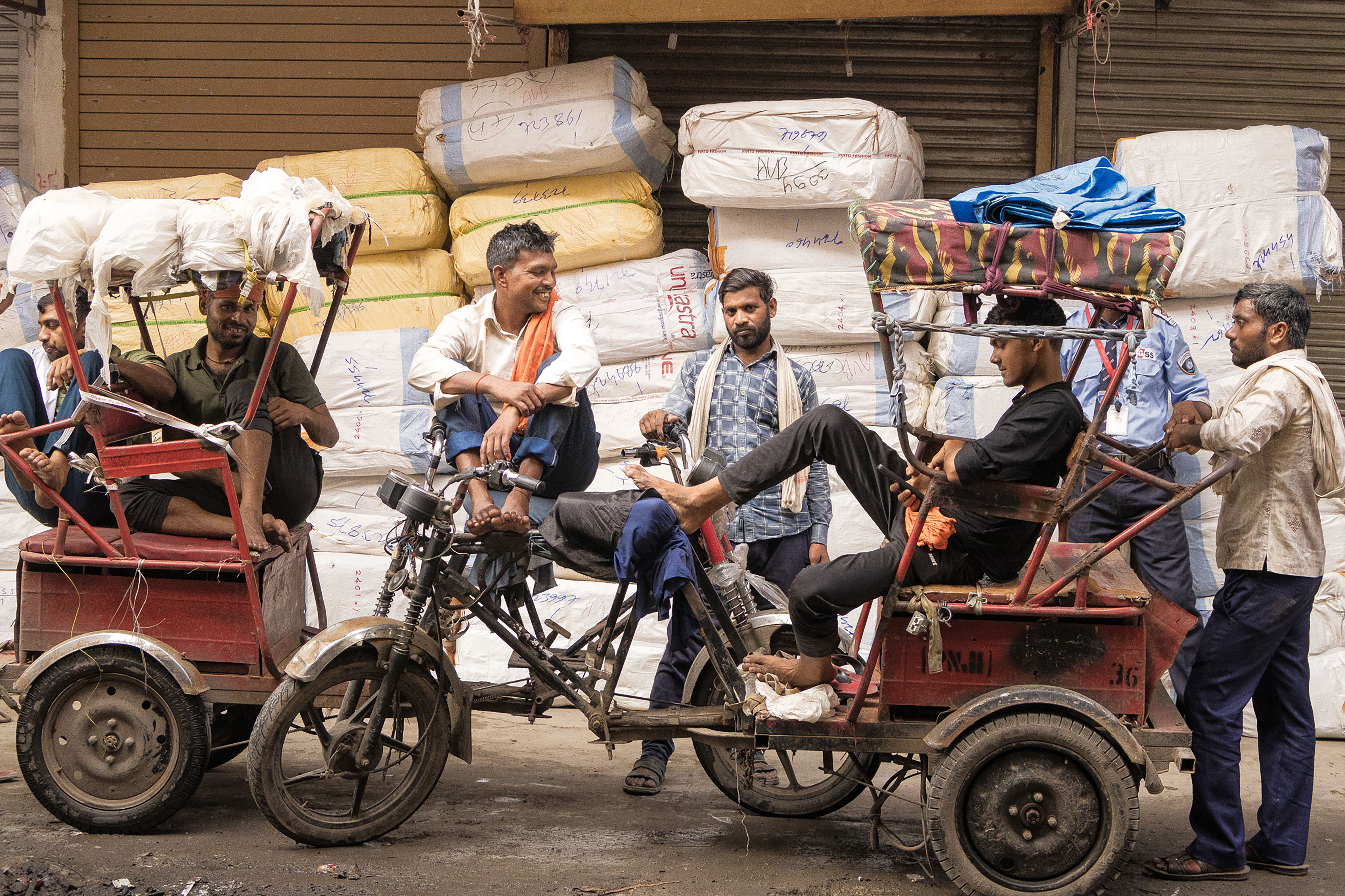 Rickshaw Drivers Resting in Busy Delhi Market · Free Stock Photo