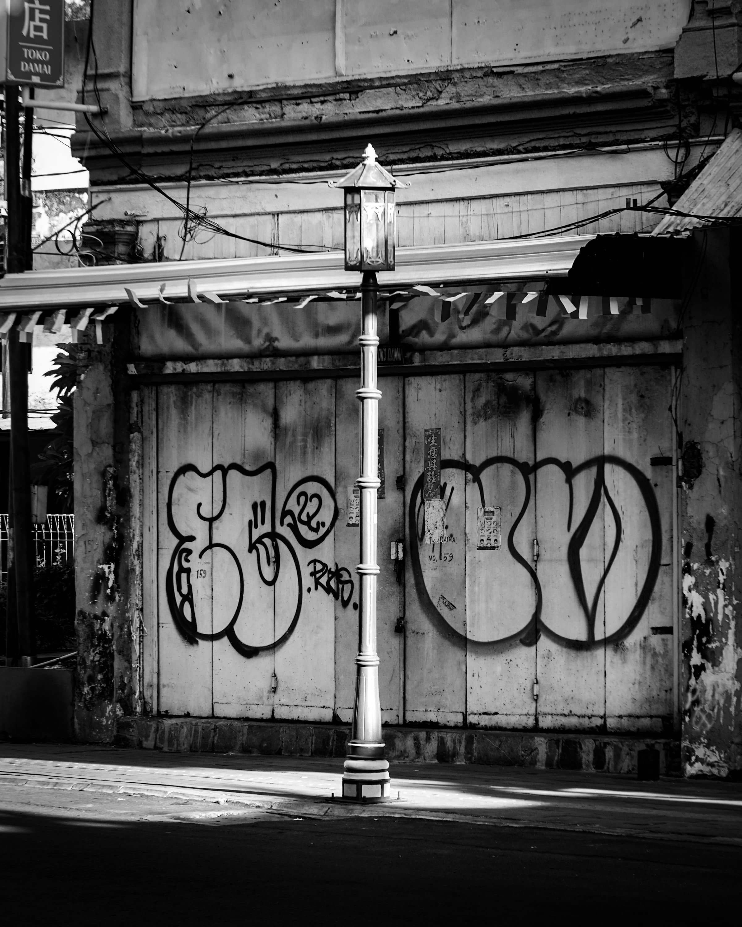 Urban Street Scene with Graffiti and Lamp Post · Free Stock Photo