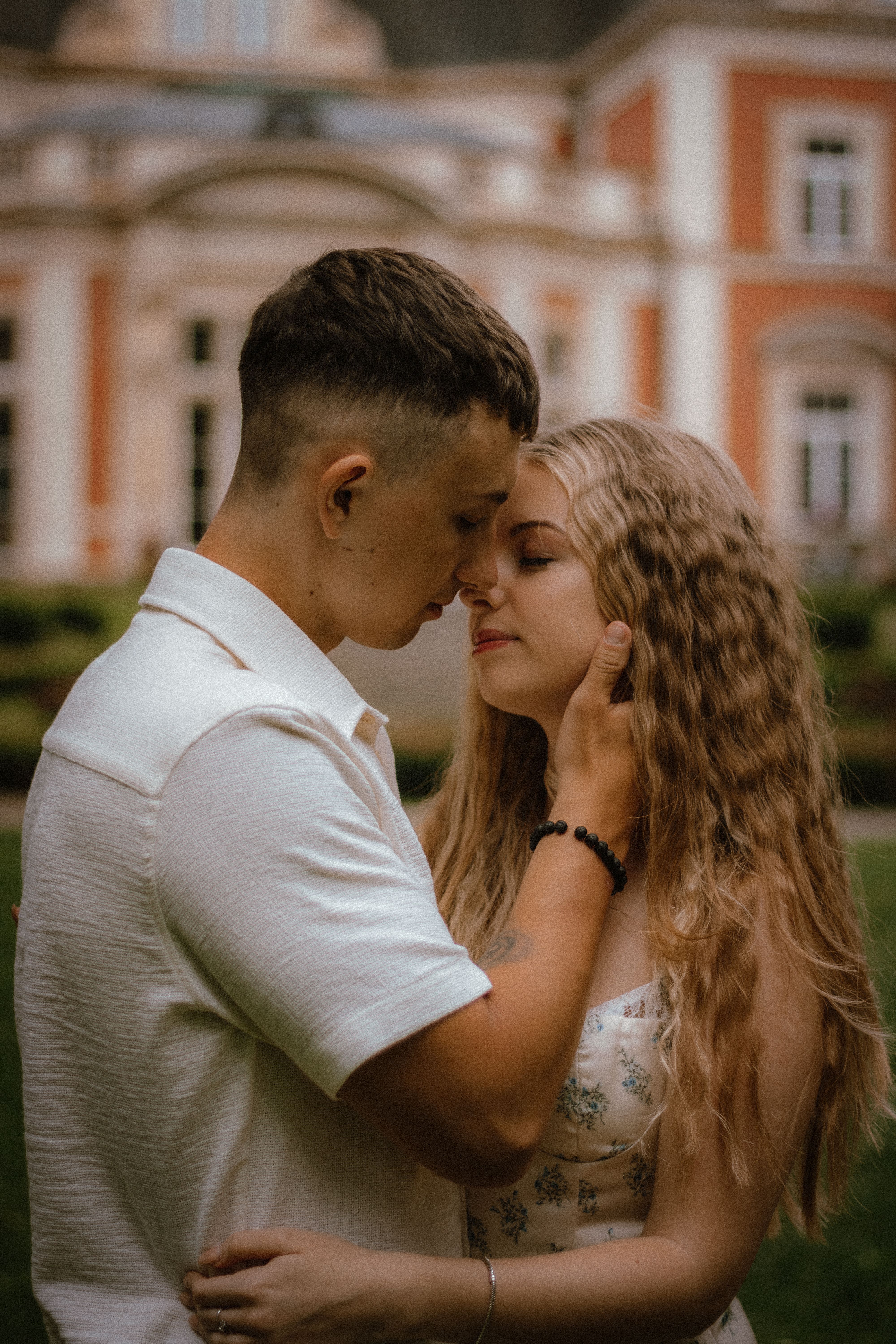 Romantic Couple Embracing Outdoors · Free Stock Photo