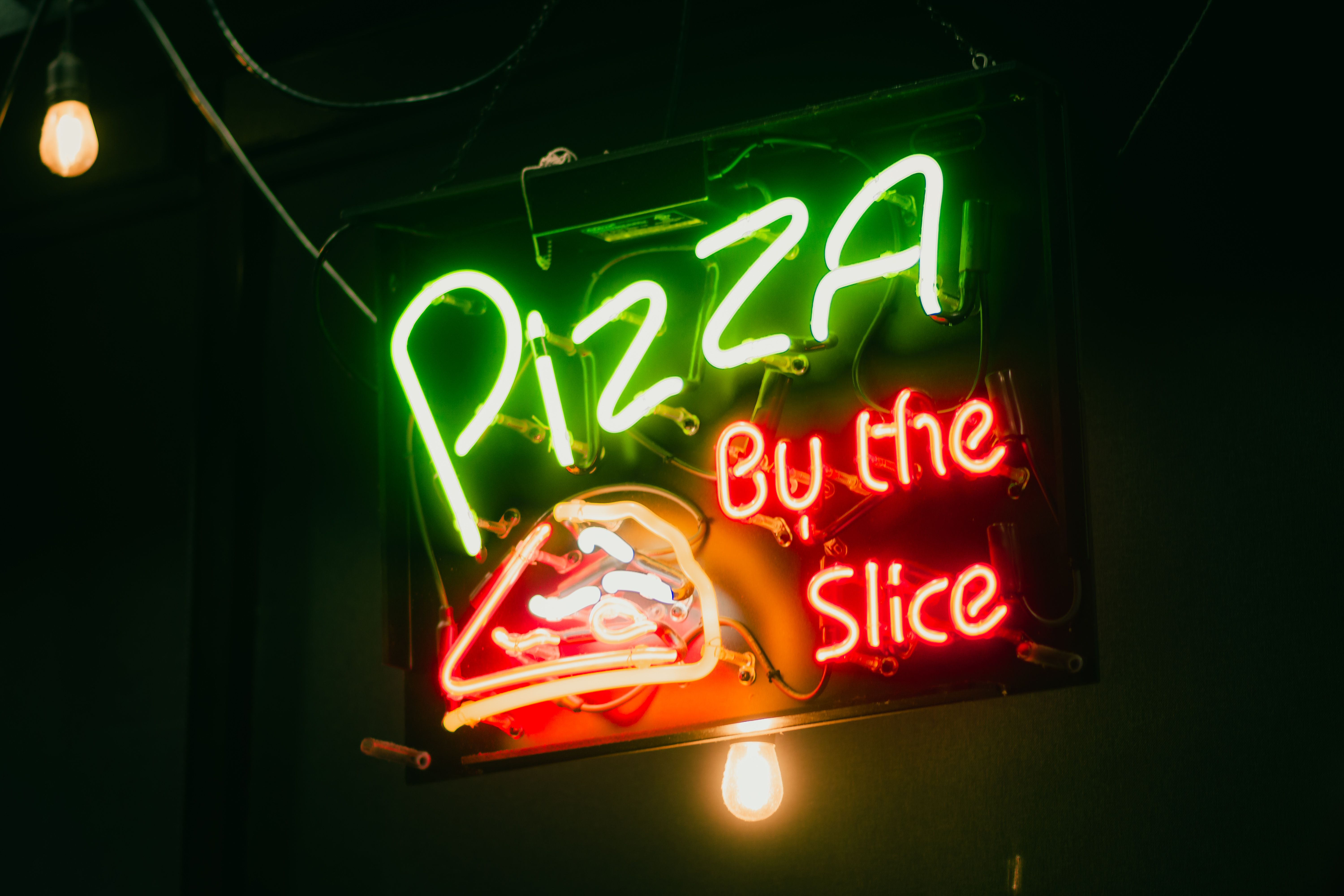 Pizza Neon Light Signage Beside Wall · Free Stock Photo