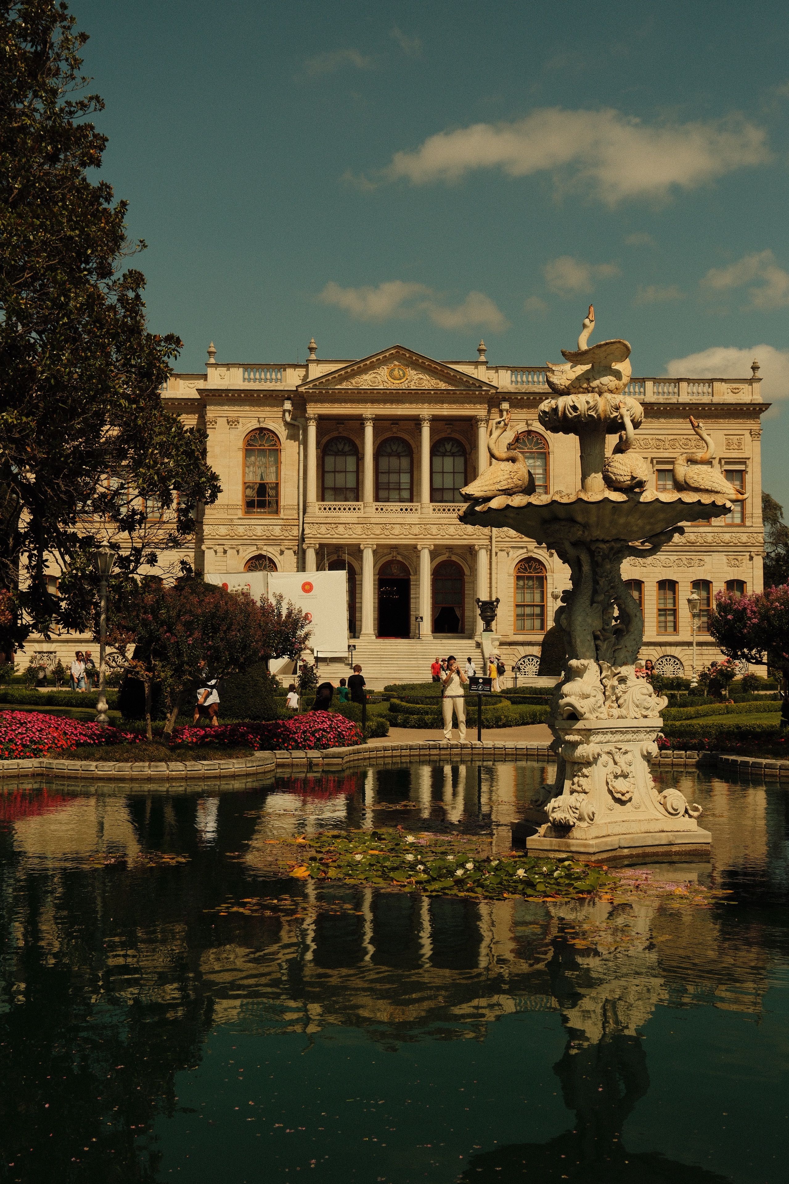 Historic Palace with Ornate Fountain in Garden Setting · Free Stock Photo