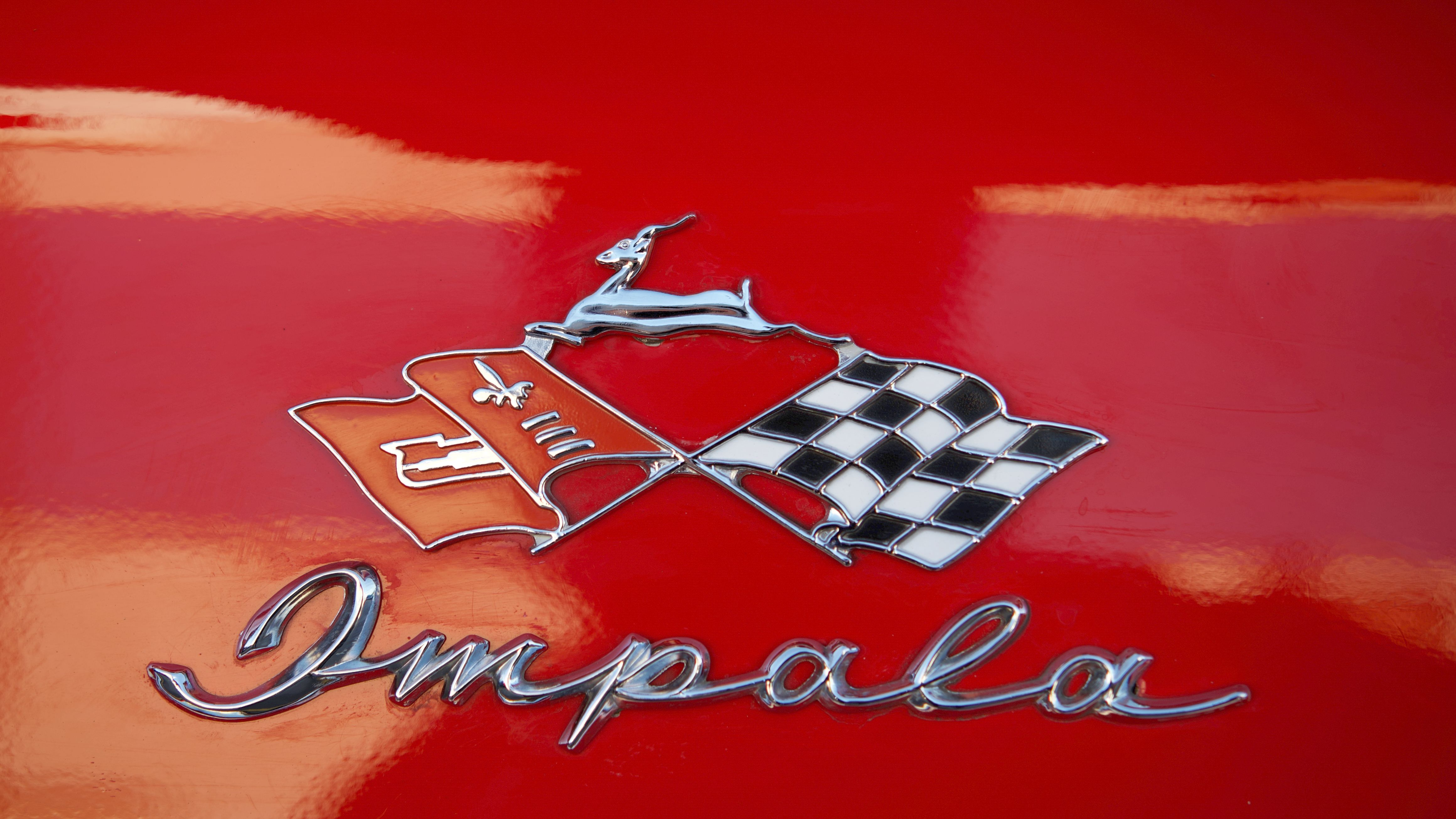 Vintage Red Chevy Impala Emblem Close-Up · Free Stock Photo
