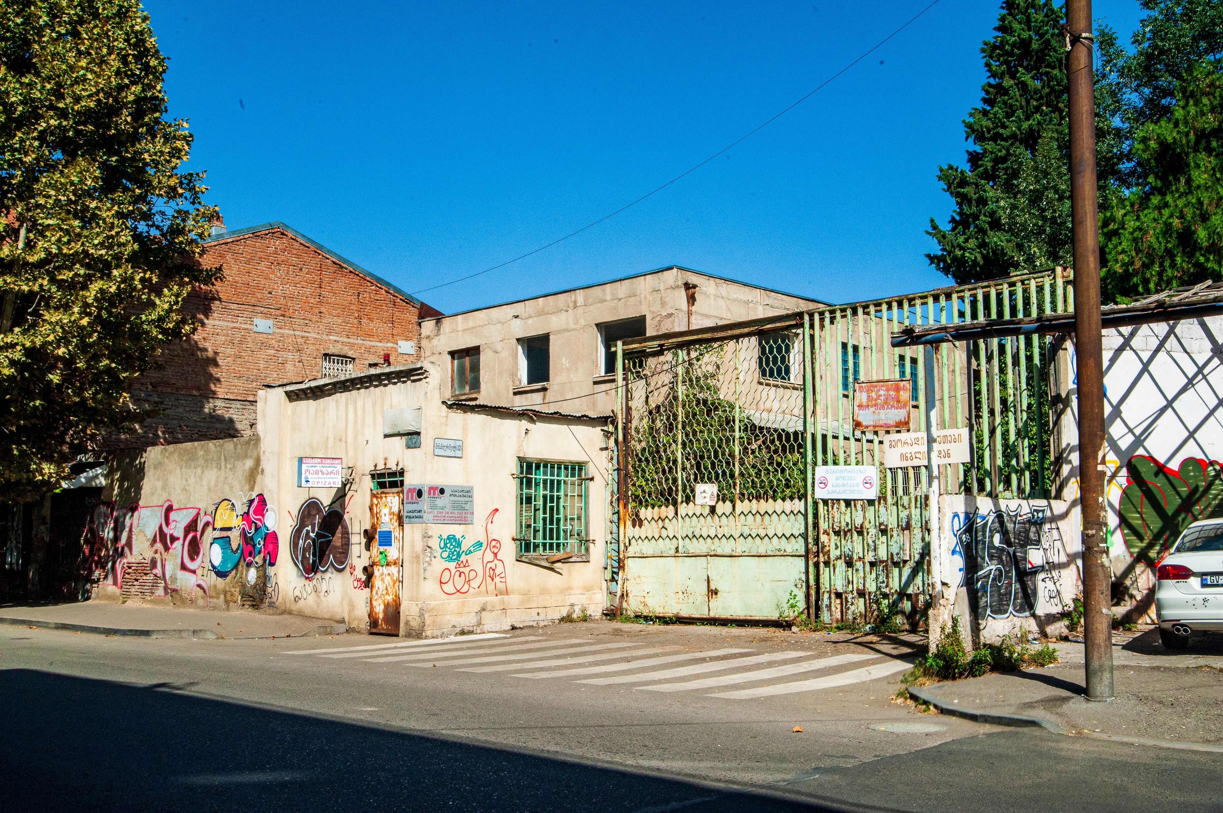 Urban Street with Graffiti and Abandoned Buildings · Free Stock Photo