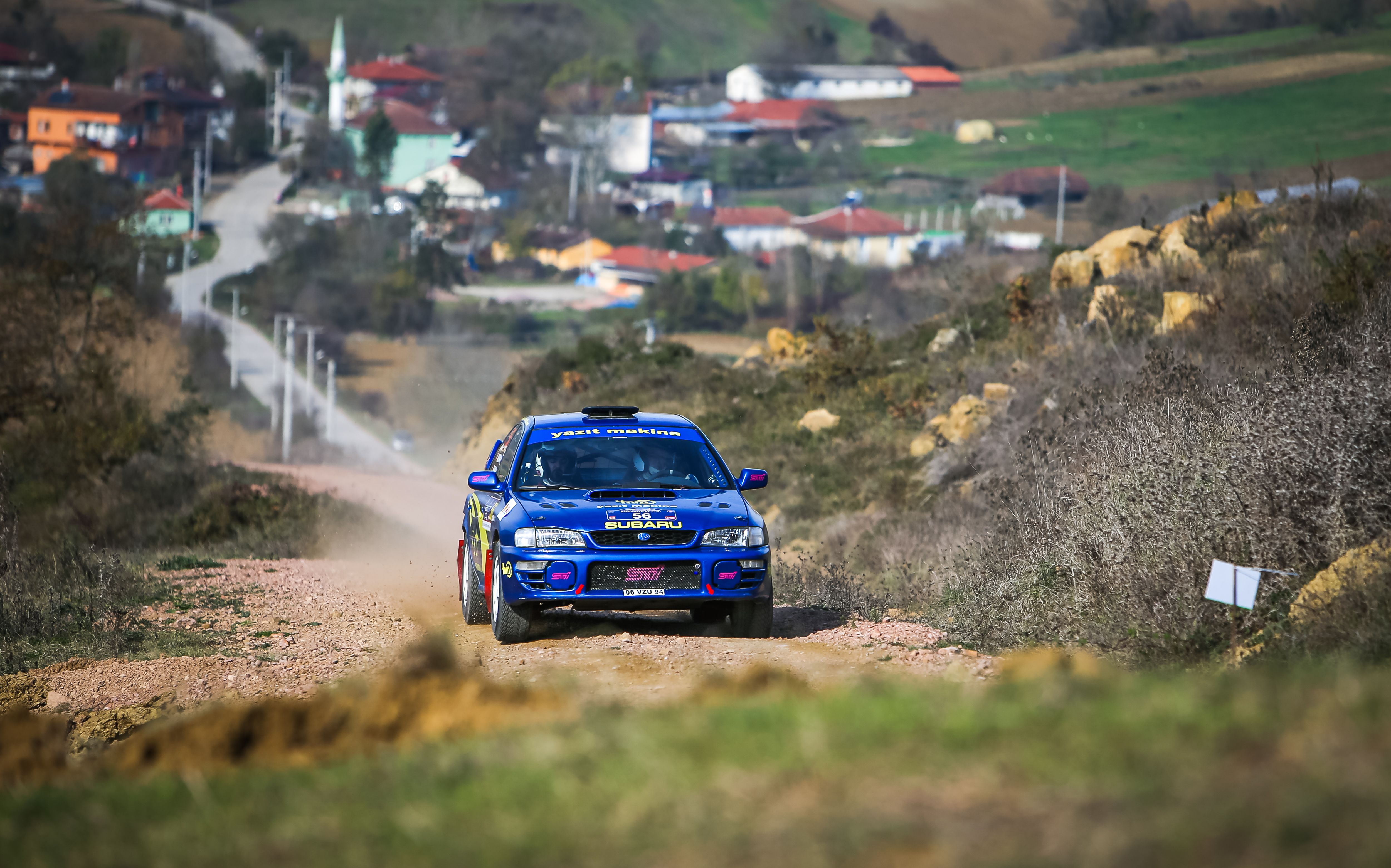 Blue Rally Car on Dirt Track in Countryside · Free Stock Photo