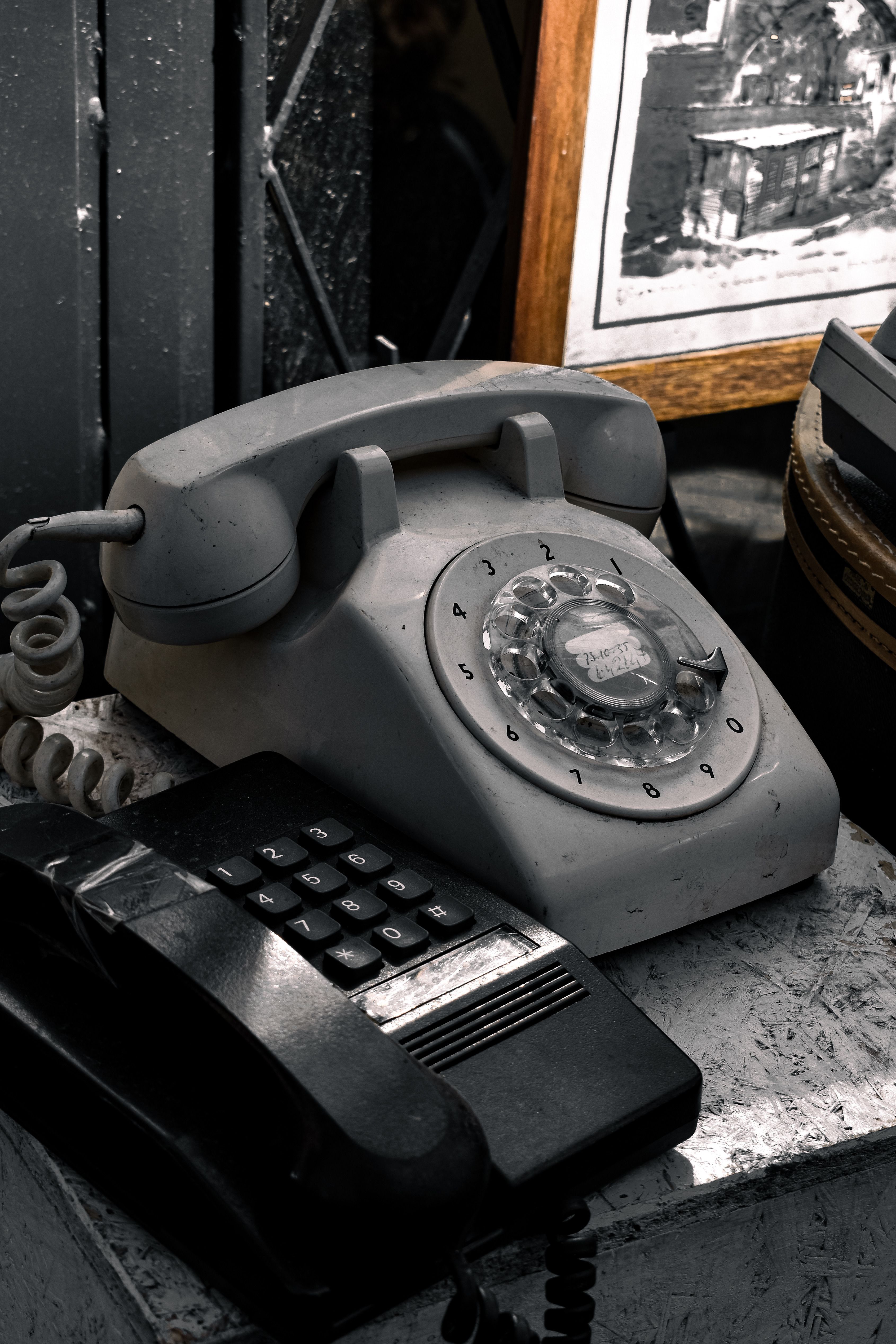 Vintage Rotary and Push Button Telephones on Desk · Free Stock Photo