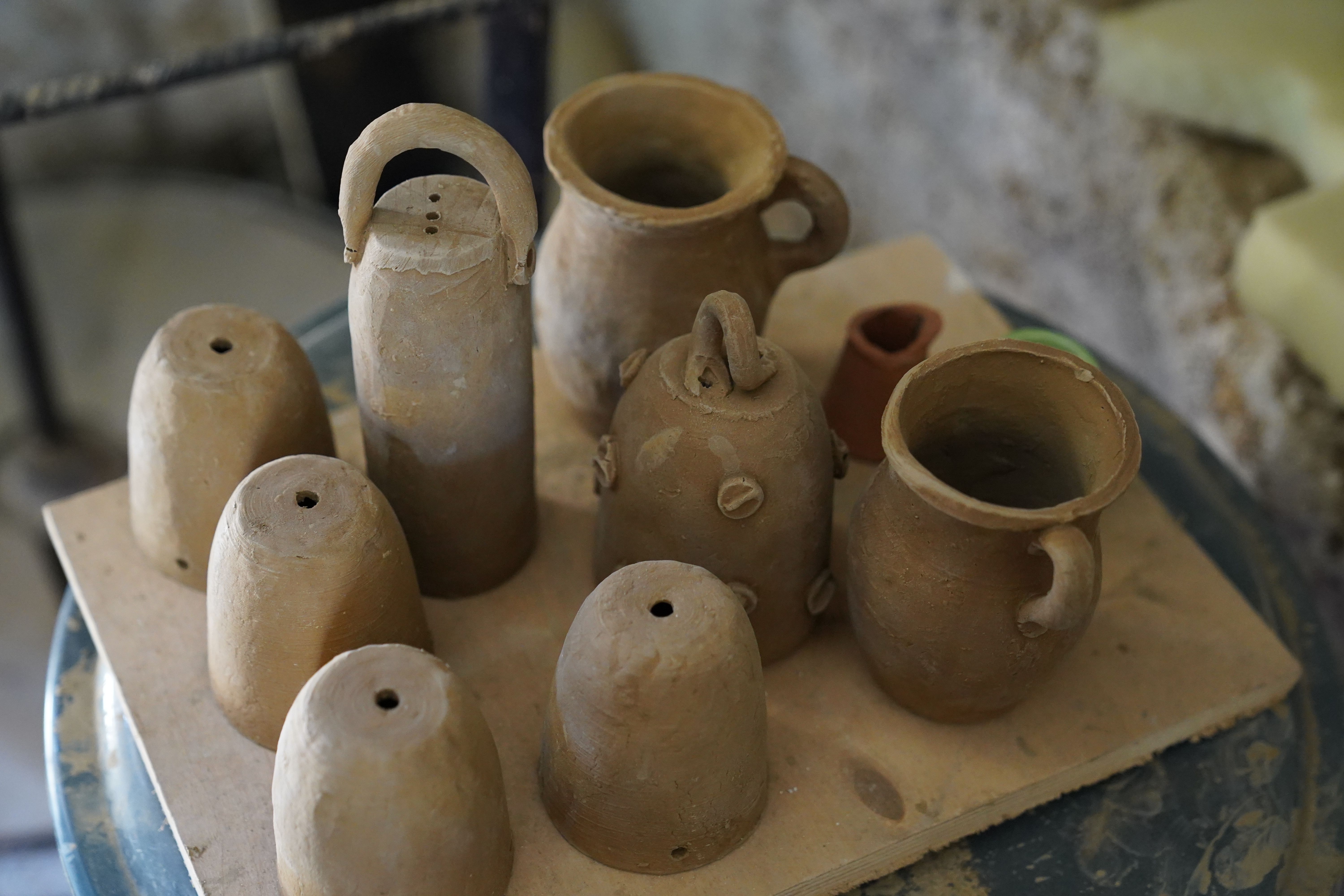 Handcrafted Clay Pots in Traditional Workshop · Free Stock Photo