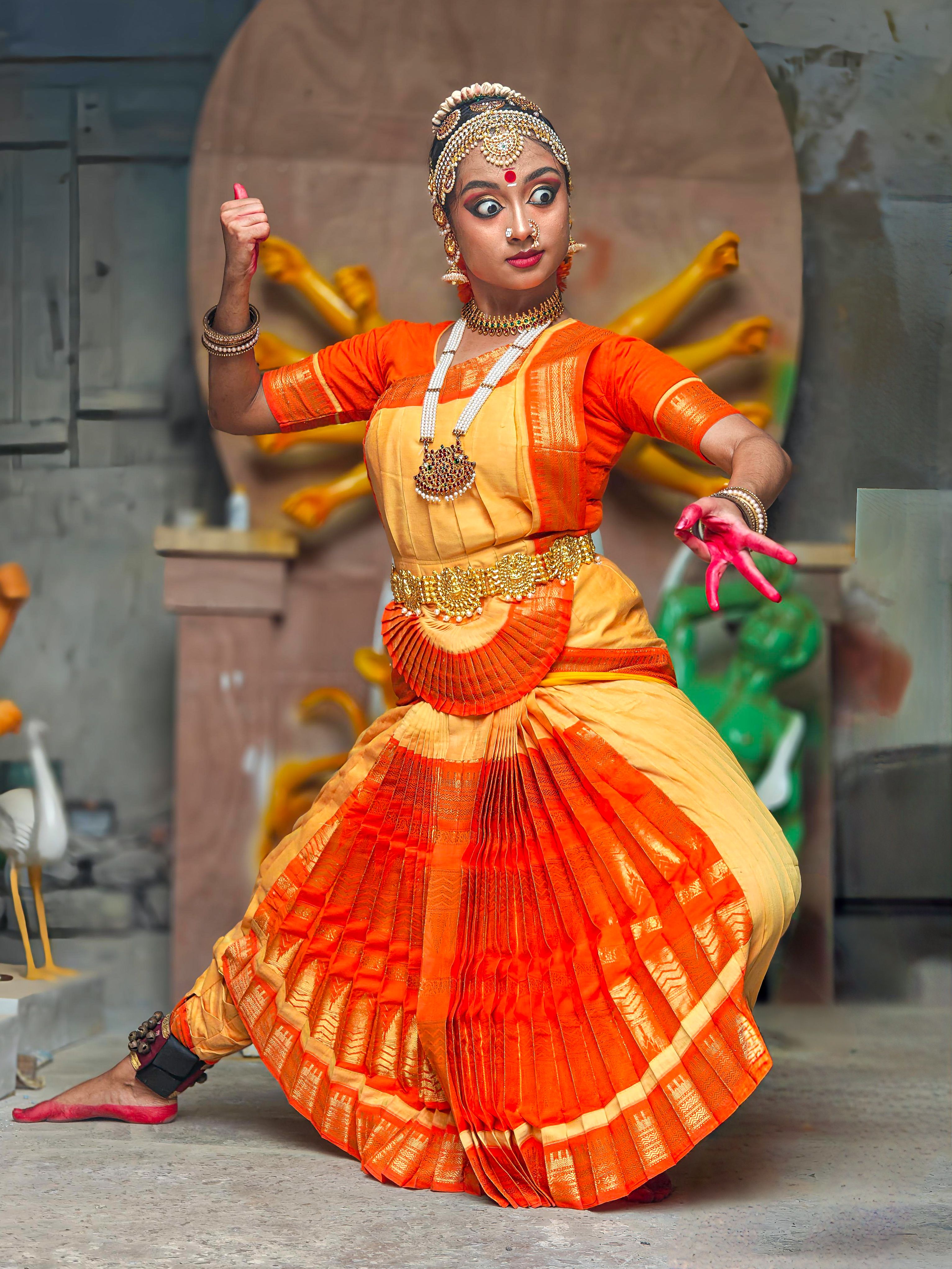 Traditional Indian Dance Performance in Vibrant Attire · Free Stock Photo