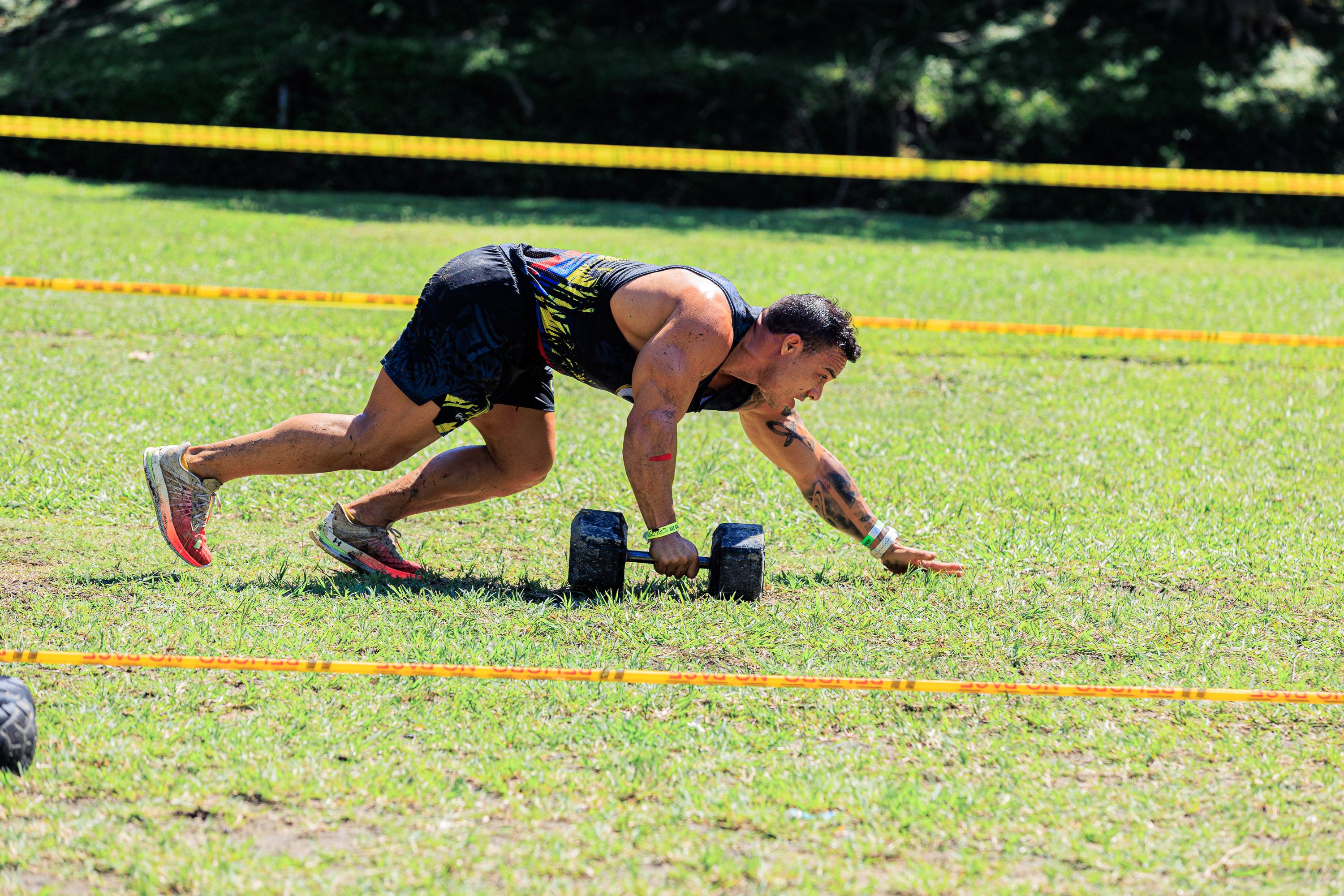 Man in Outdoor Fitness Competition with Dumbbells · Free Stock Photo