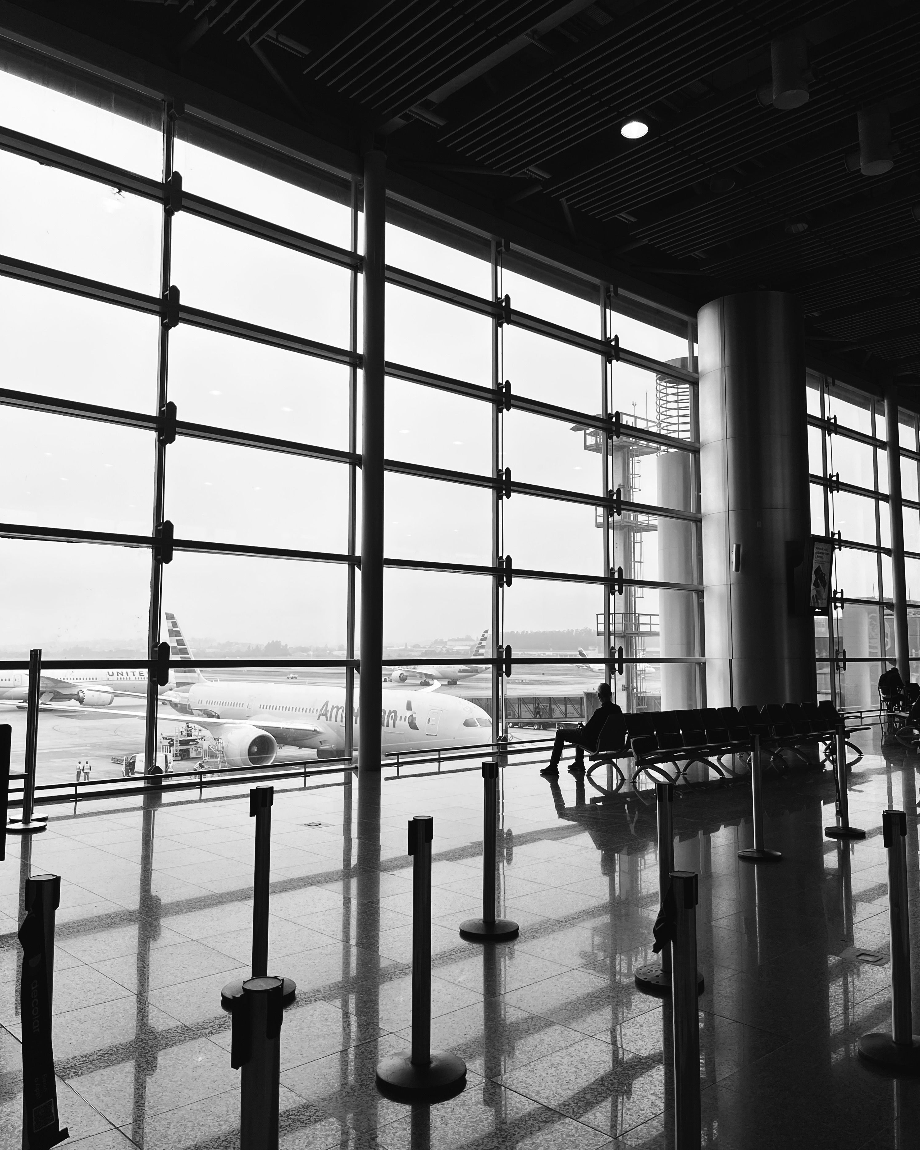 Modern Airport Terminal with Airplane View · Free Stock Photo